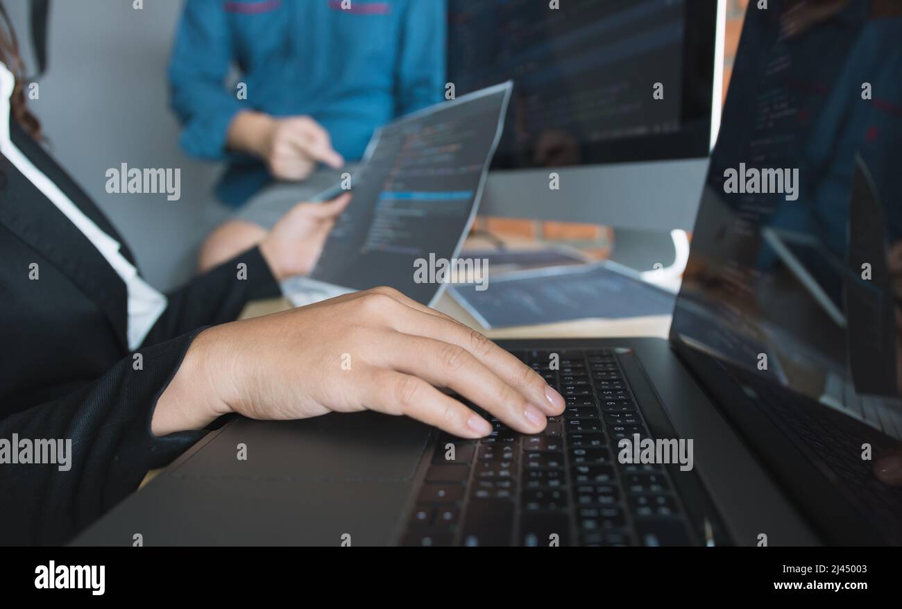 Asian man working code program developer computer web development working design software on ...