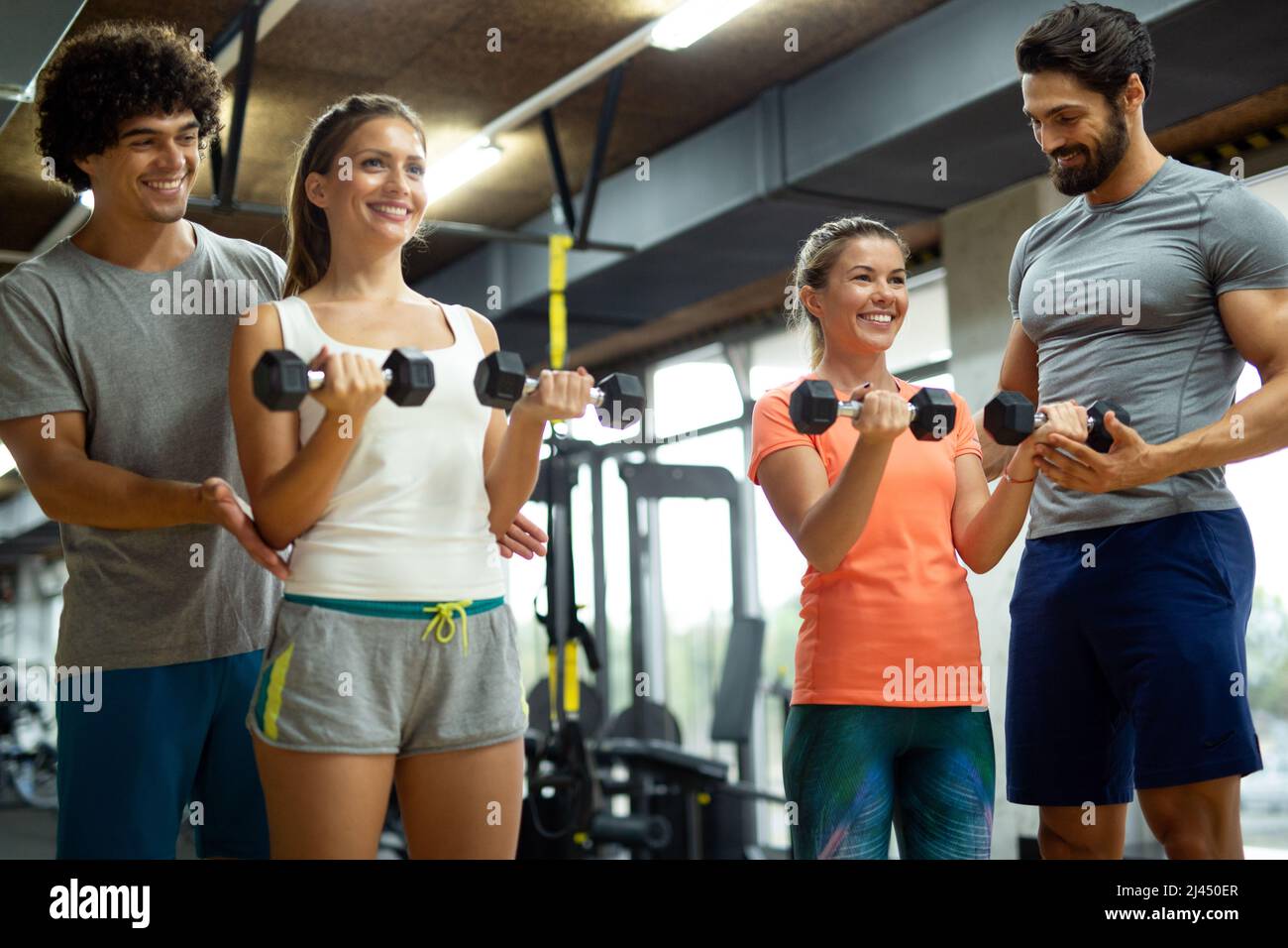 Portrait of happy fit group of people working out in gym together Stock ...