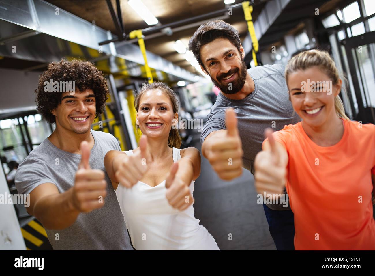 Portrait of happy fit group of people working out in gym together Stock ...