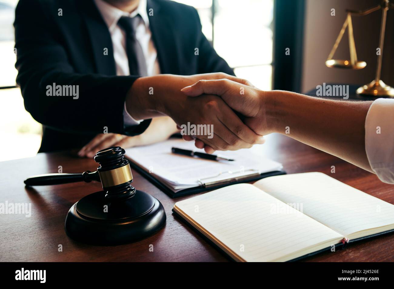 Lawyer is currently shaking hands with the client about the success in ...