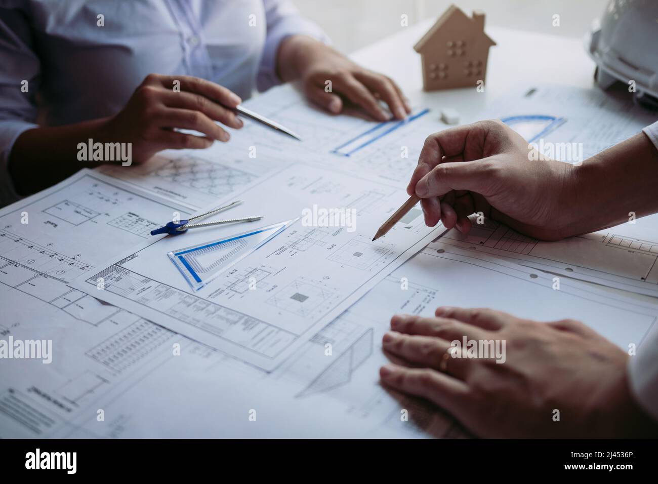 Structural engineering designers are working on the blueprints and ...