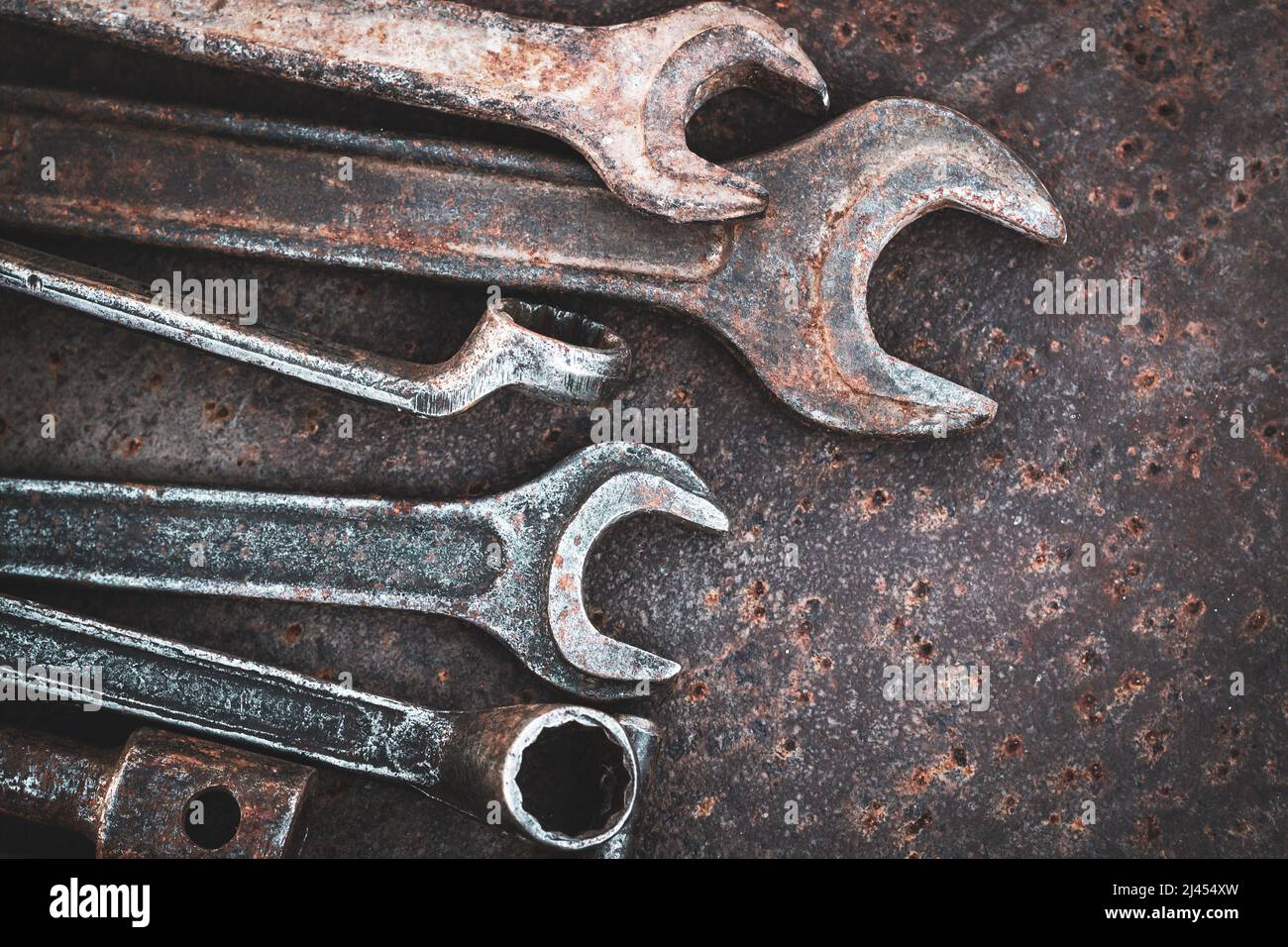 Collection of old wrenches on a rusty metal table. Top view Stock Photo ...