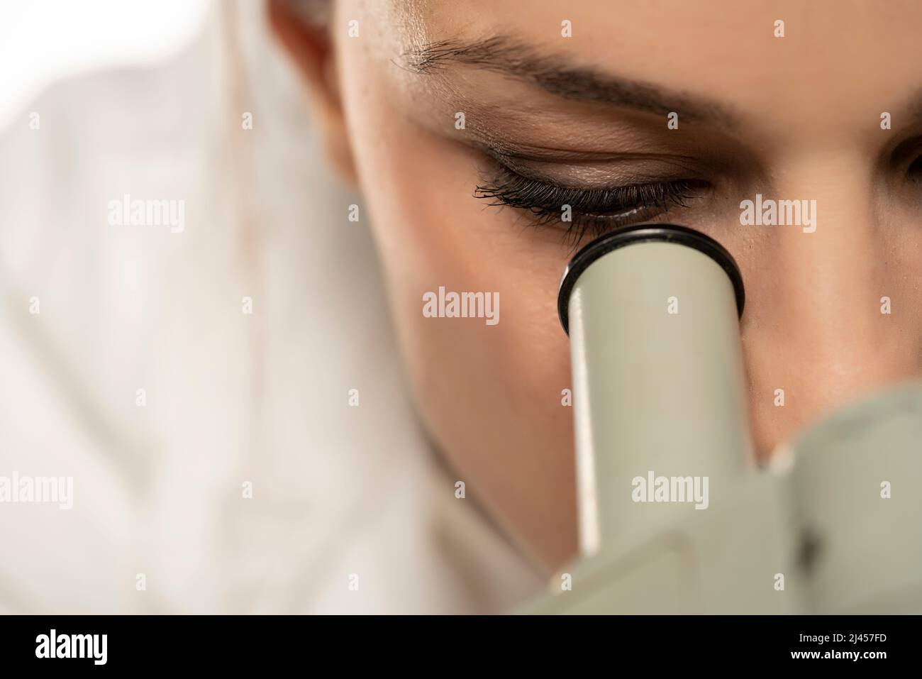 Macro Close Up Shot of a Female Scientist Looking into the Microscope ...