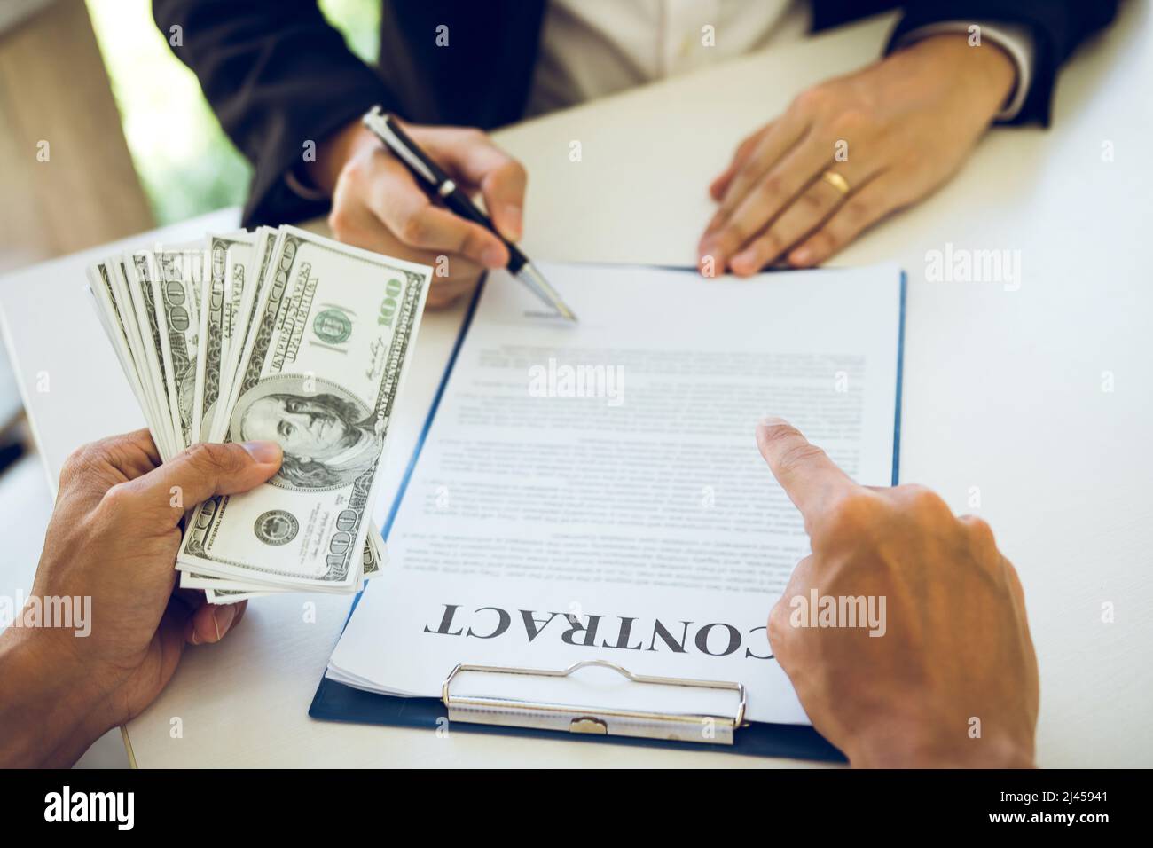 Employees are doing corruption by giving dirty money to signing contract Stock Photo - Alamy