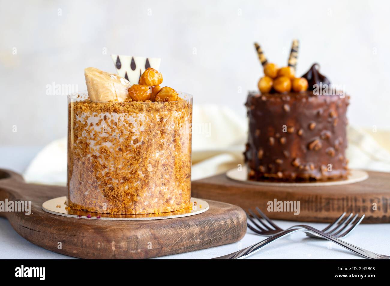 Types of cakes. Varieties of small cakes on a white background. Bakery ...