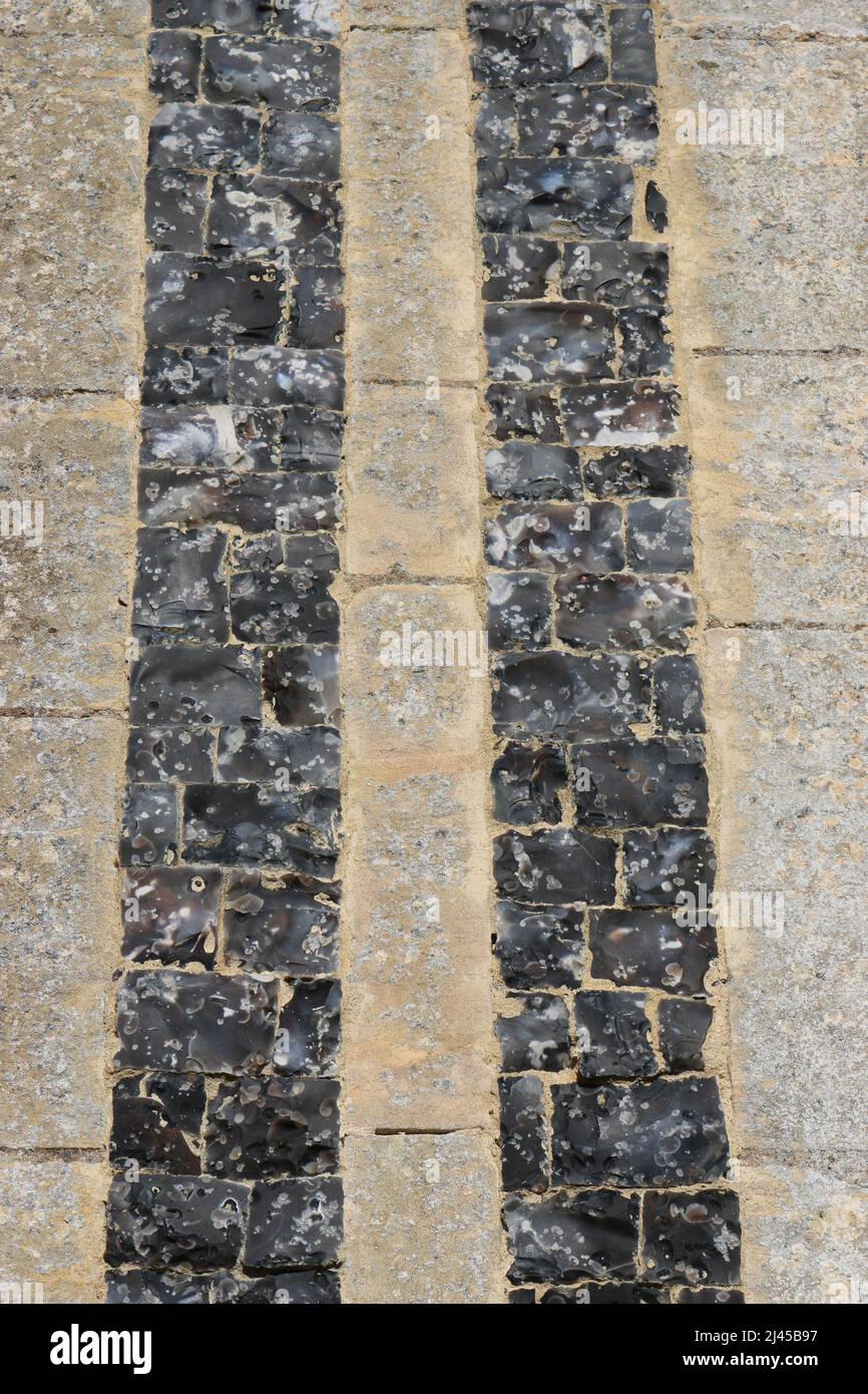 Two columns of ornamental knapped flint pieces, cut and set into the ...