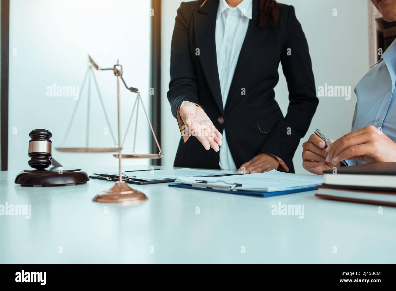 Legal advisor is explaining the offense under the law in the book at ...