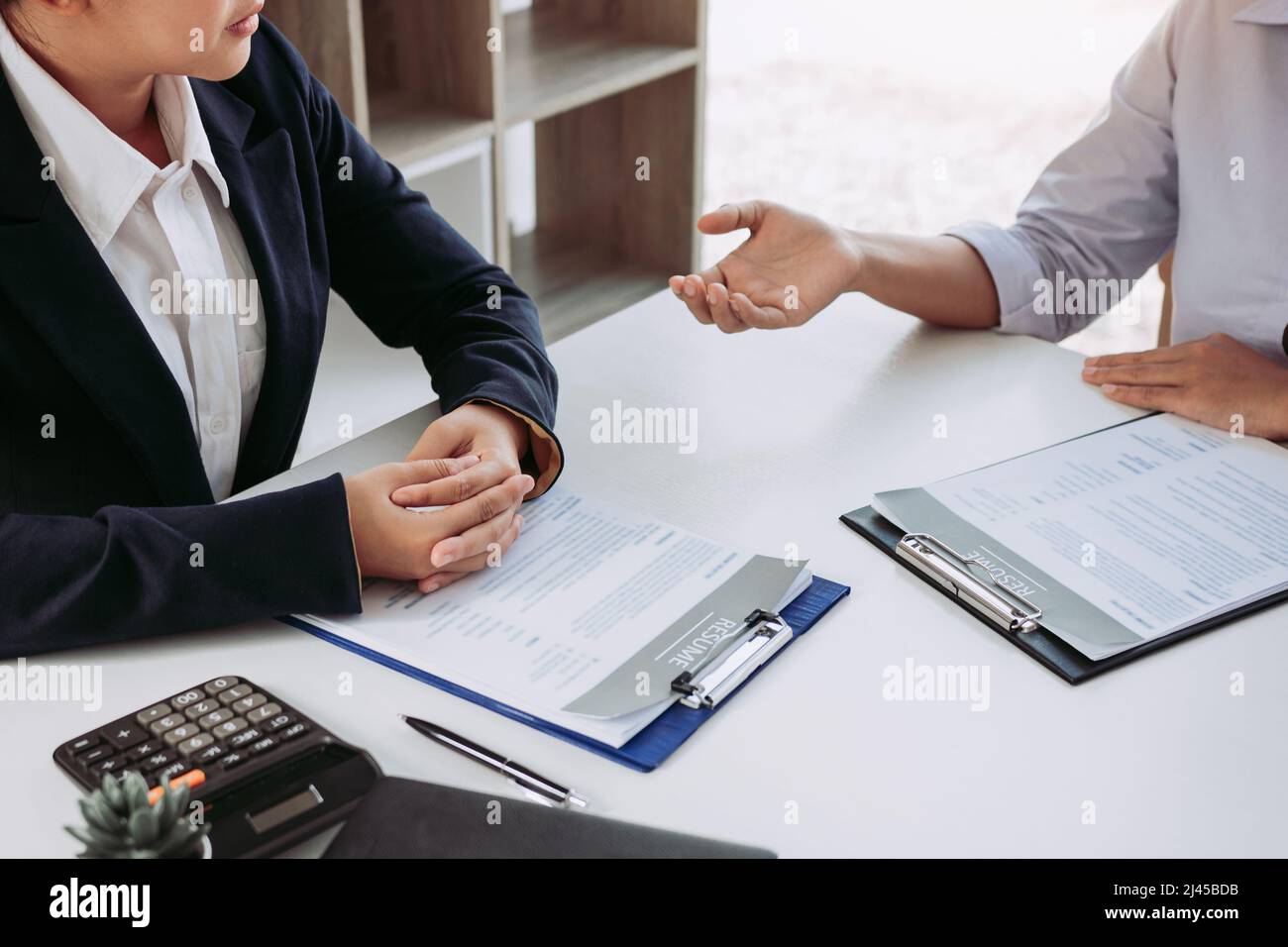 Young professional being interviewed hi-res stock photography and ...