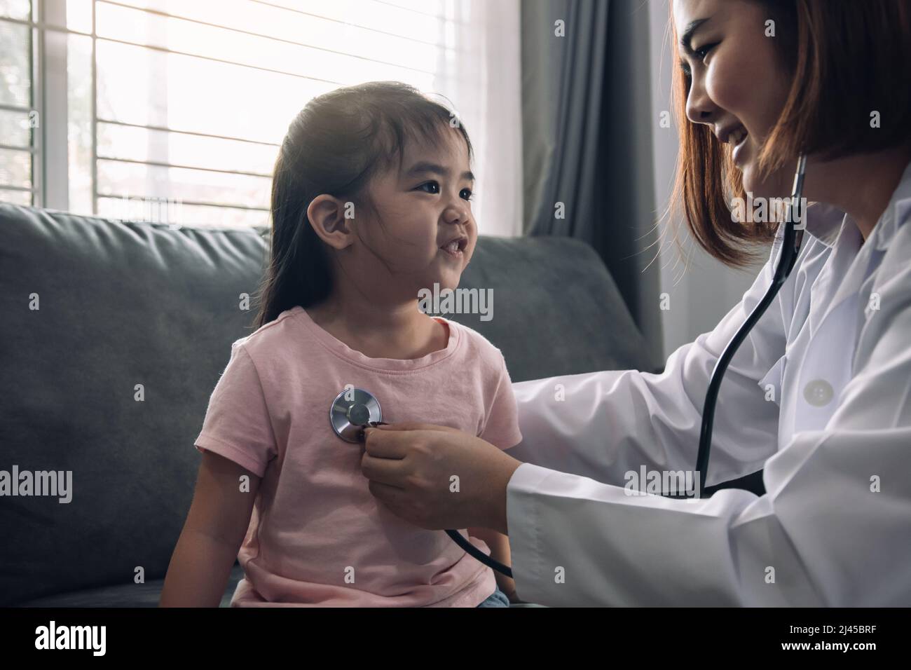 Confident asian woman healthcare professional visit her patient using a ...