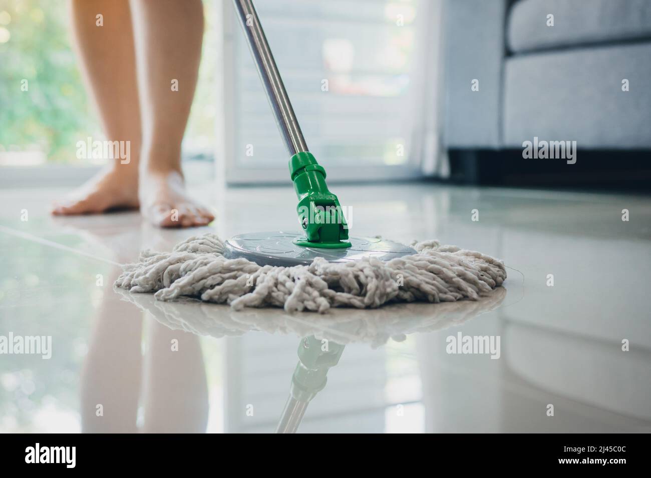 Asian women cleaning folk using mop tiles Stock Photo - Alamy
