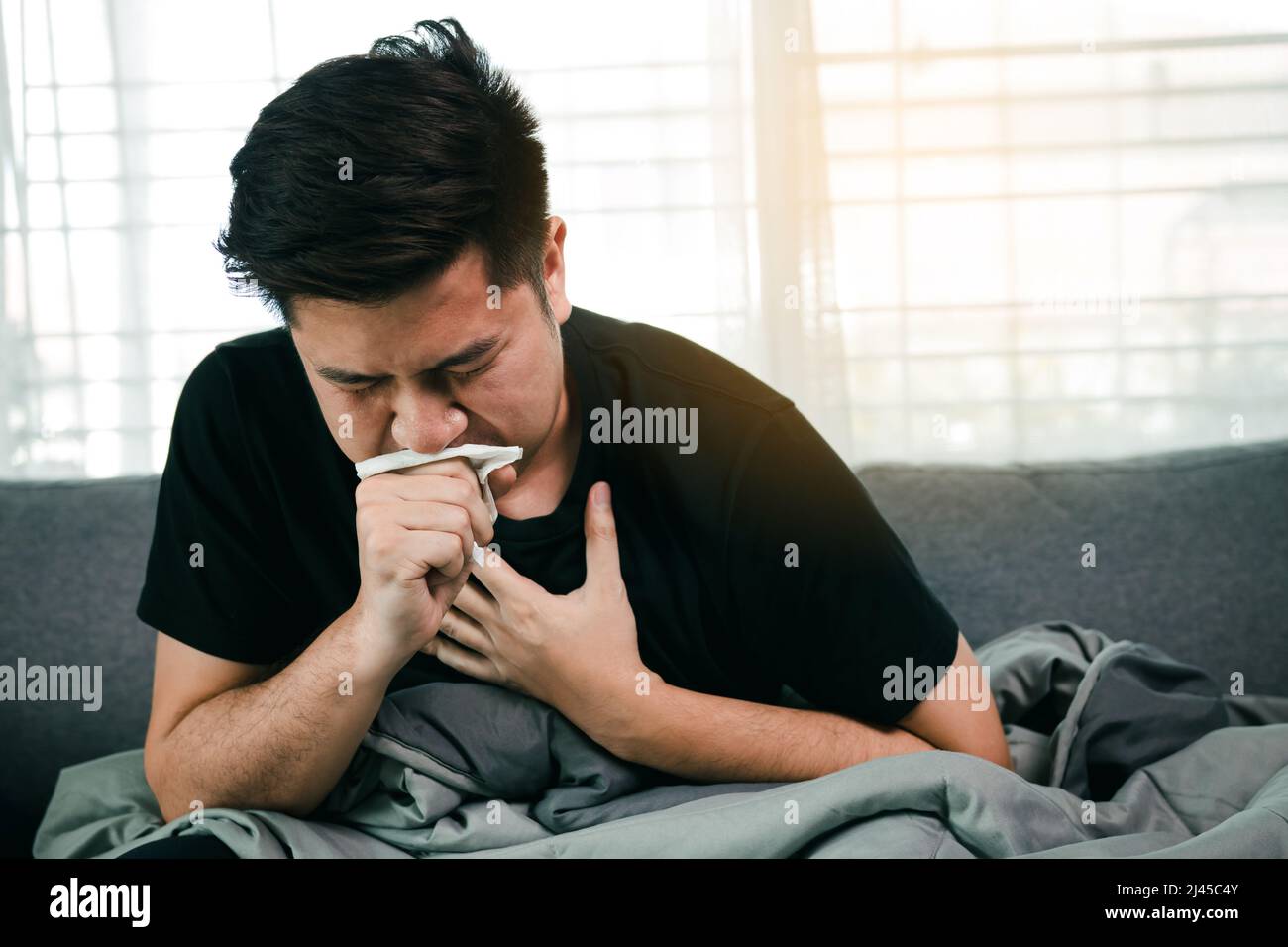 Asian people are sick or ill with bronchitis while coughing by covering ...
