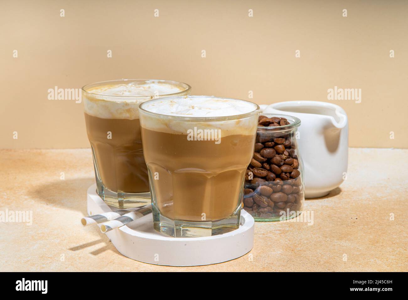 Cold dairy coffee drink with milk, whipped cream. Foamy frappe, latte ...