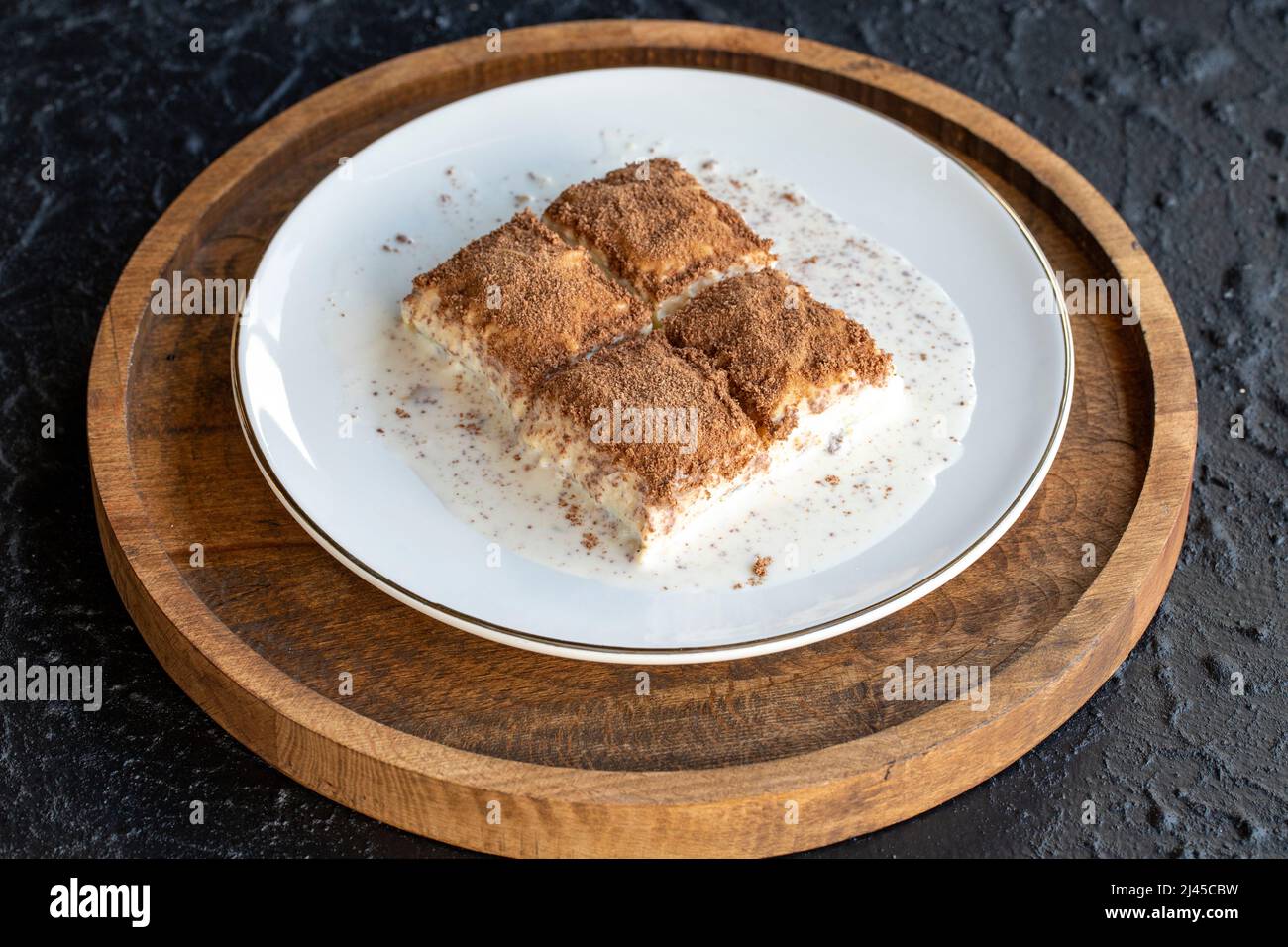 Cold baklava on a dark background. Baklava with pistachio milk ...