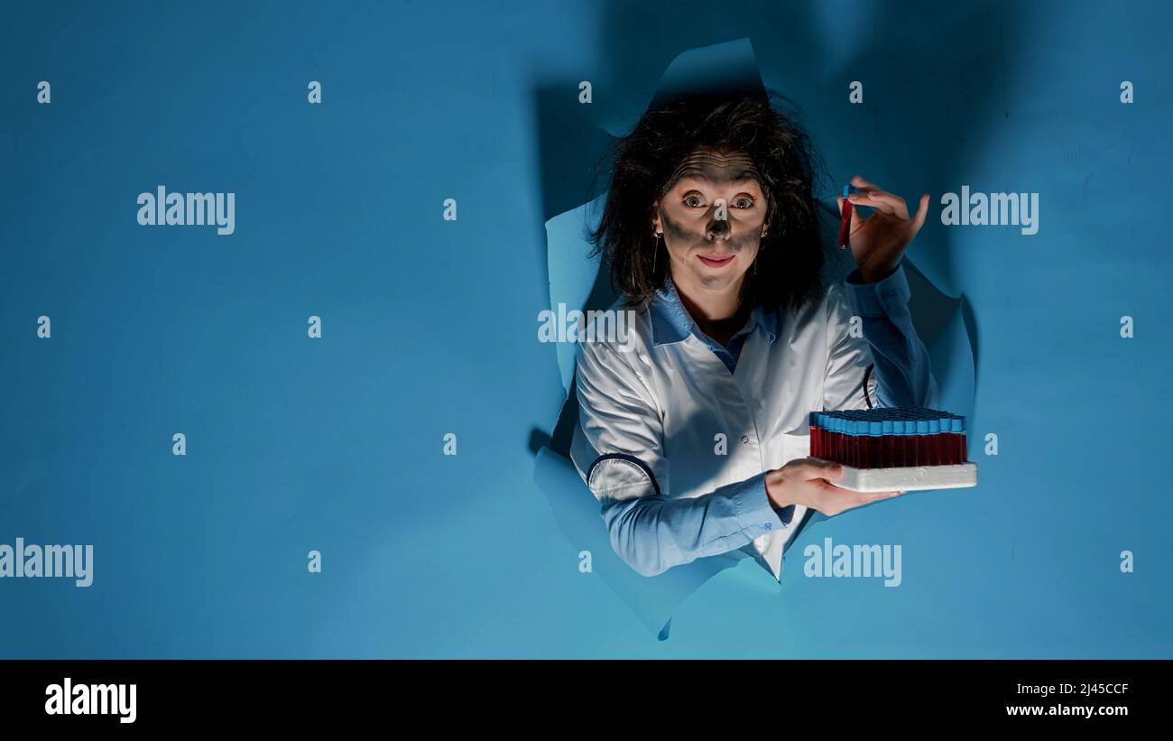 Mad foolish scientist woman with frizzy hair explosion holding test ...