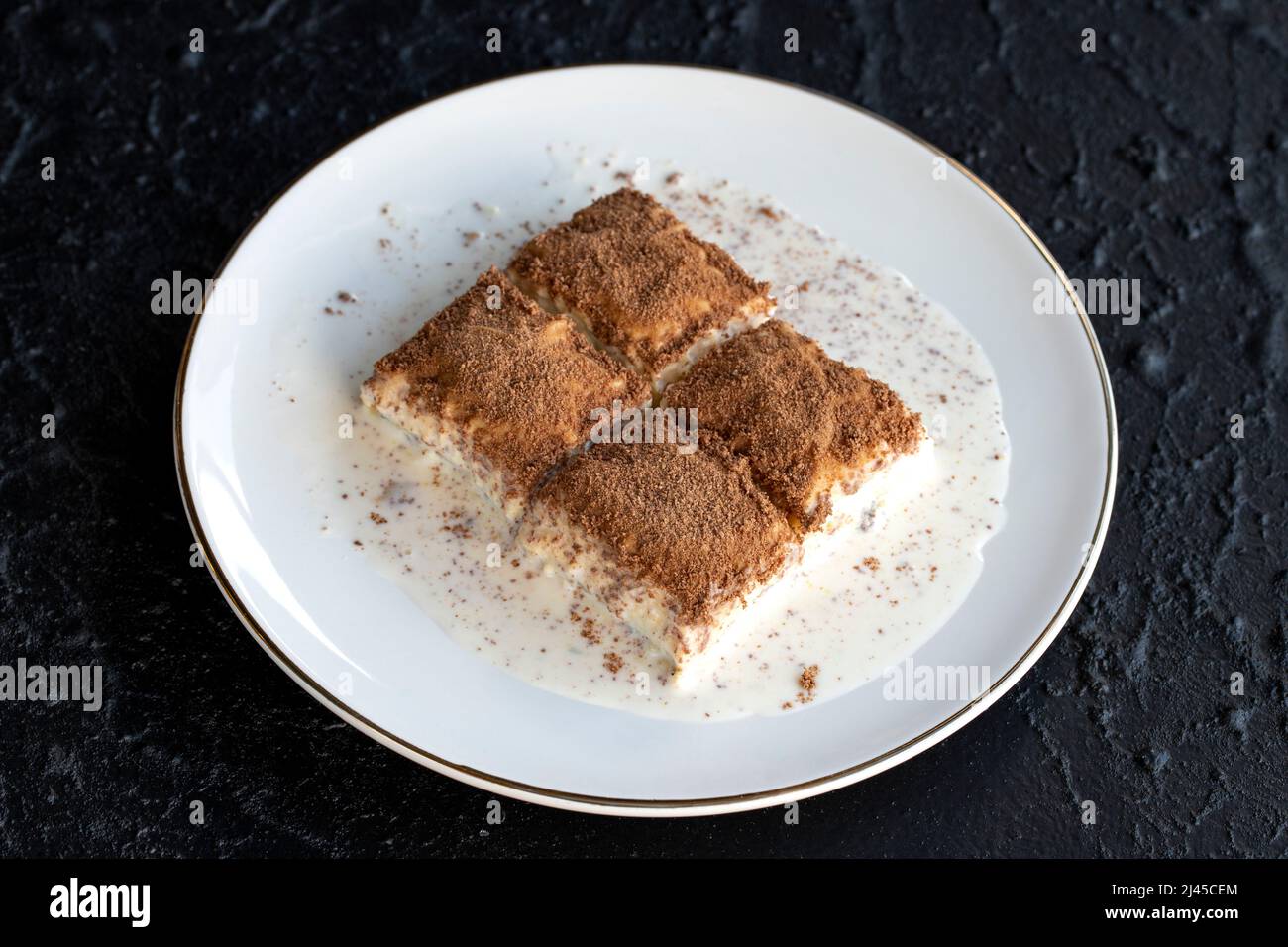 Cold baklava on a dark background. Baklava with pistachio milk ...