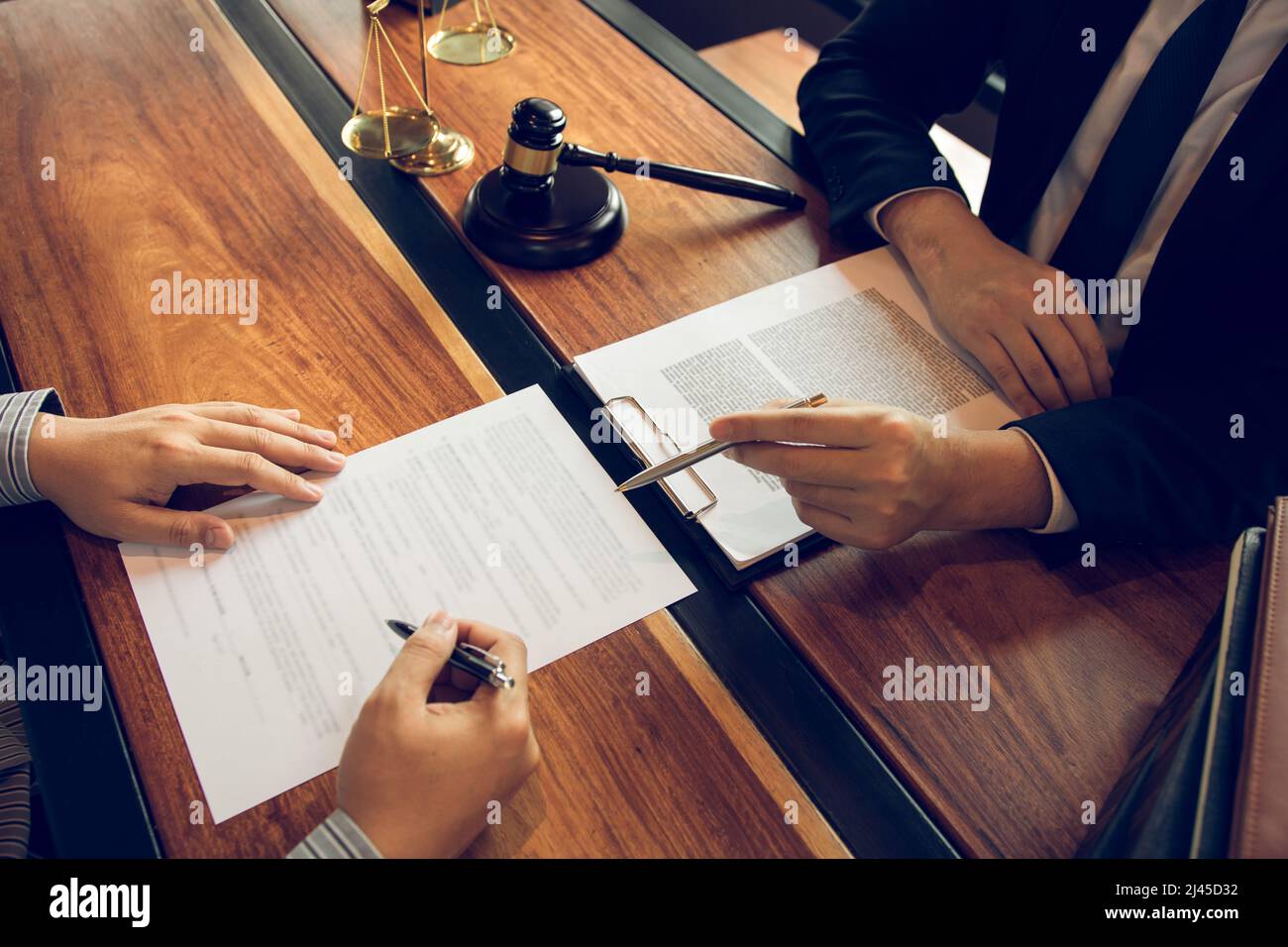 Lawyer is explaining about the wrongdoing laws regarding fraud to the ...