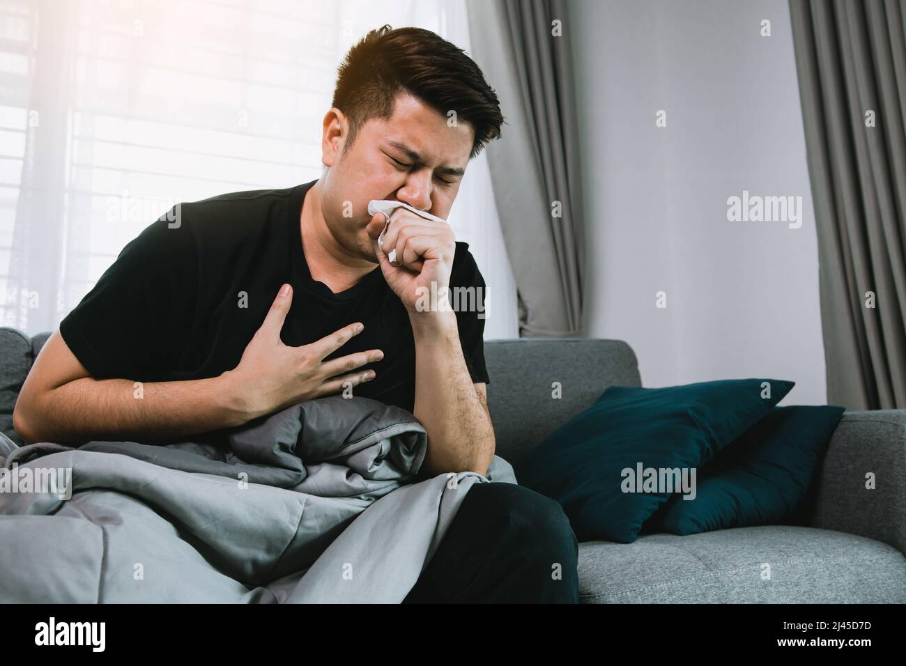 Asian people are sick or ill with bronchitis while coughing by covering ...