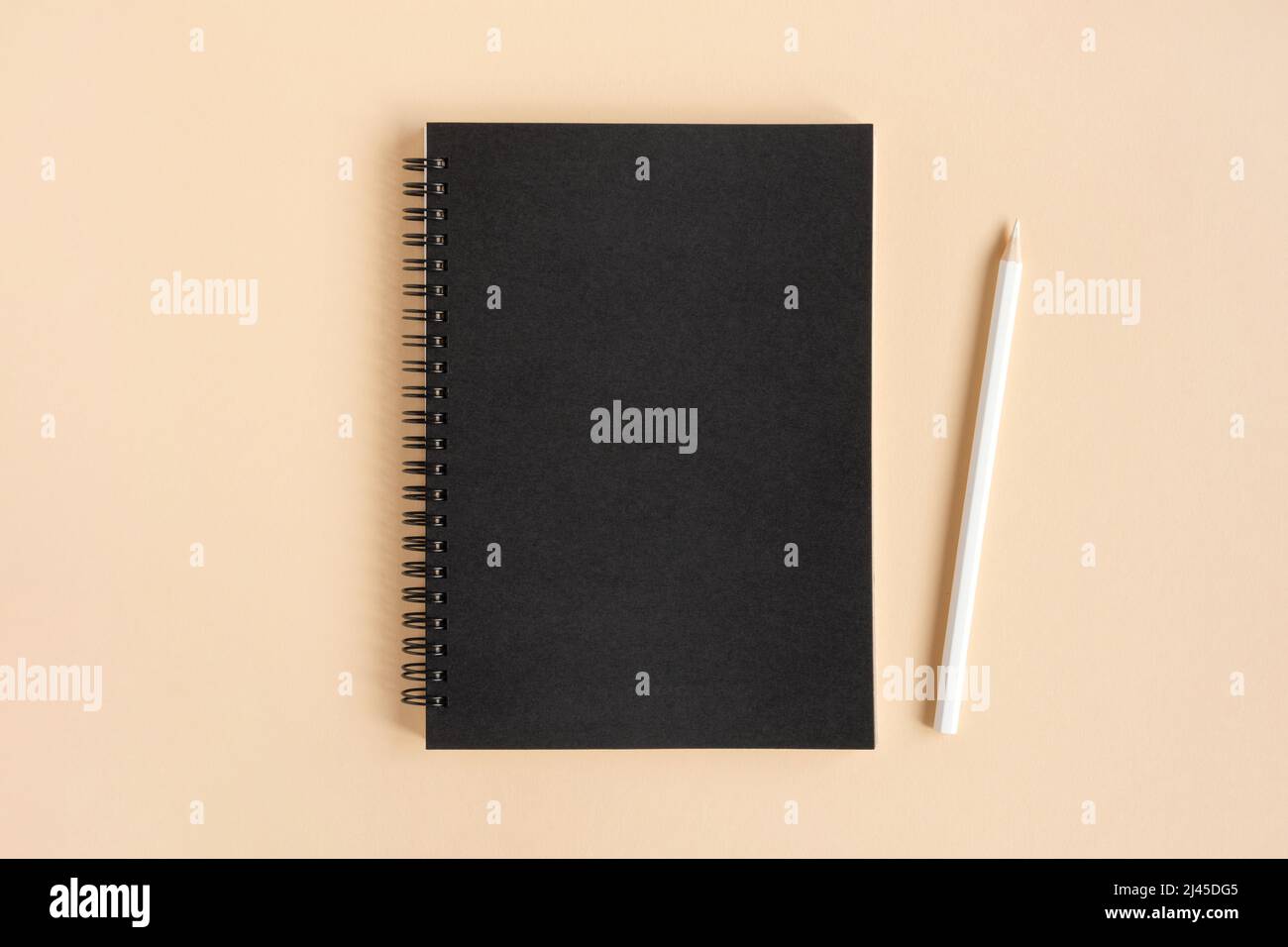 Notebook with pencil. Open notebook on beige color background, office ...