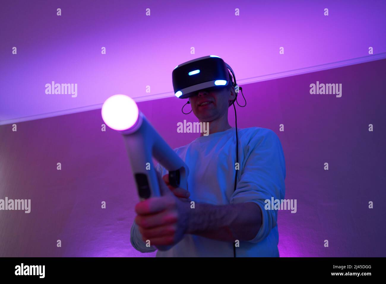 Man with virtual reality headset and joystic is playing game Concept of ...