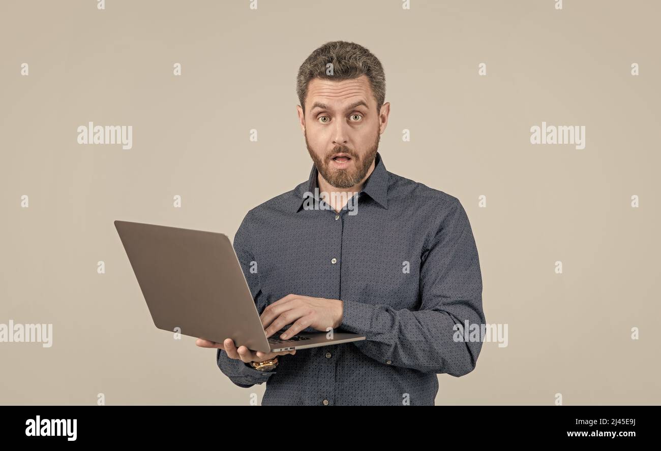 surprised businessman work online. business success. programmer man use pc Stock Photo - Alamy