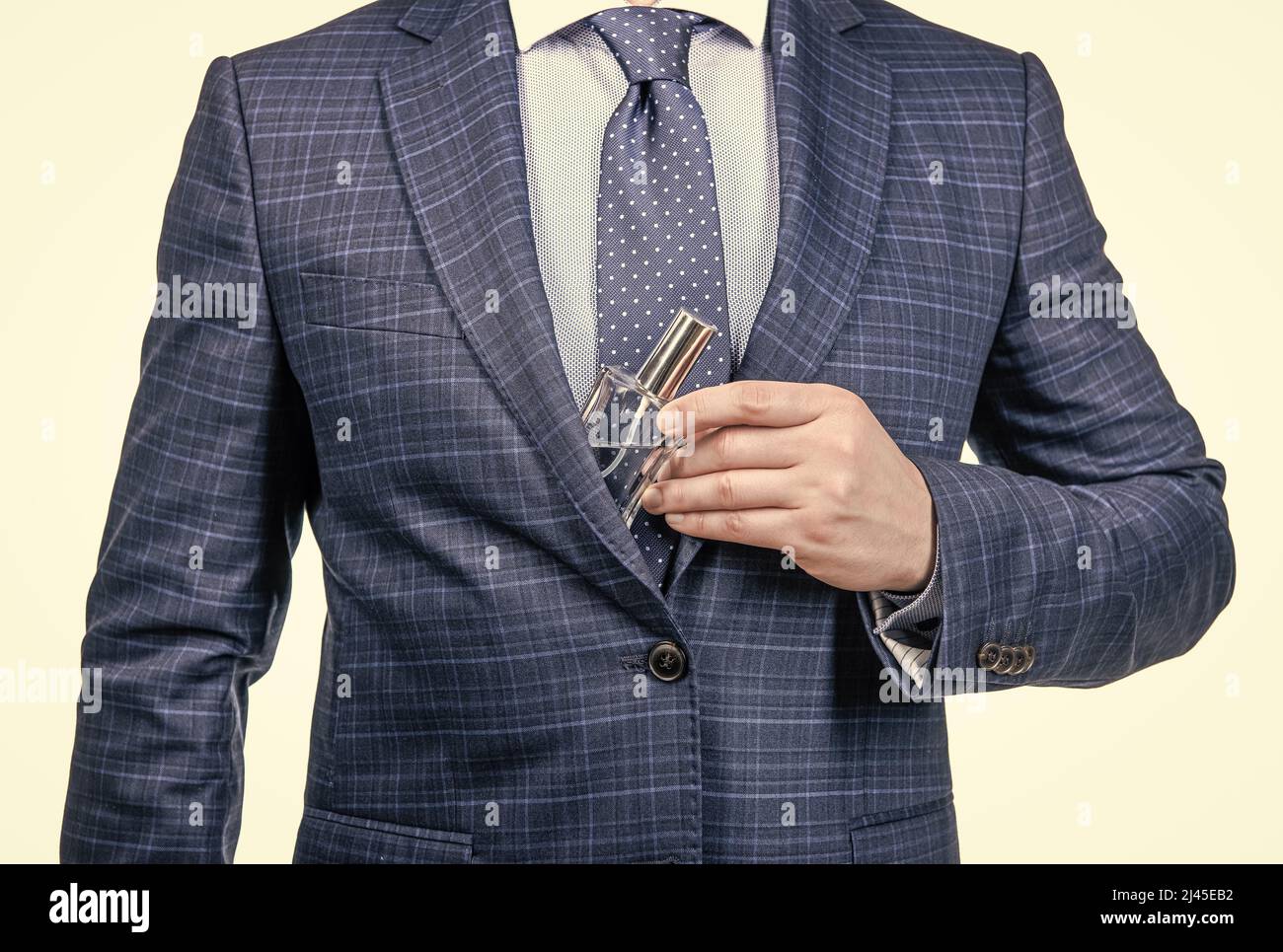 Businessman cropped view pull perfume bottle from suit jacket isolated ...