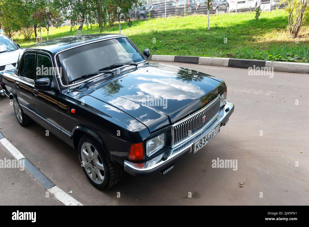 Volga GAZ 31 black car at the entrance of the house Stock Photo - Alamy