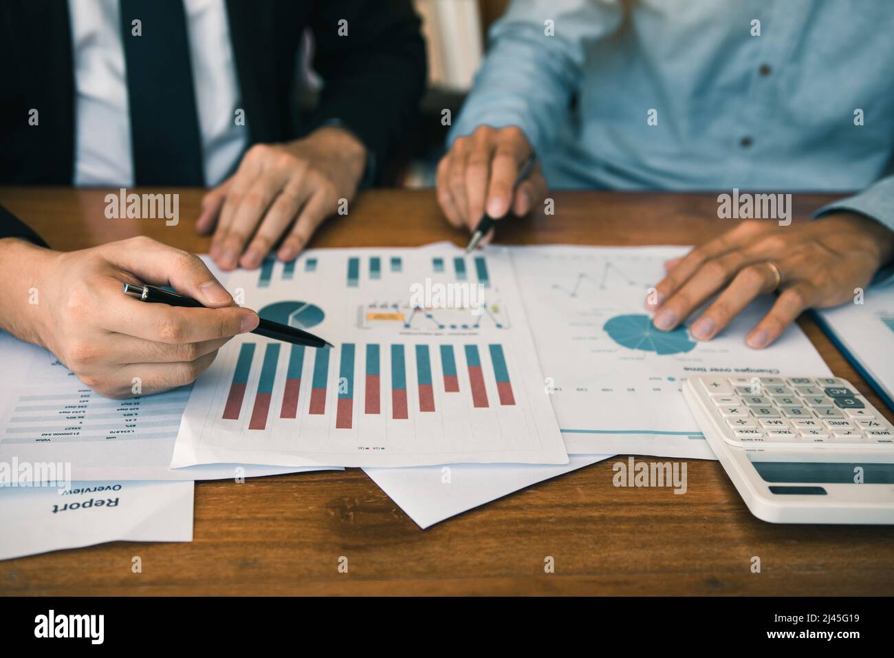 Two businessmen discussion analysis sharing calculations about the ...