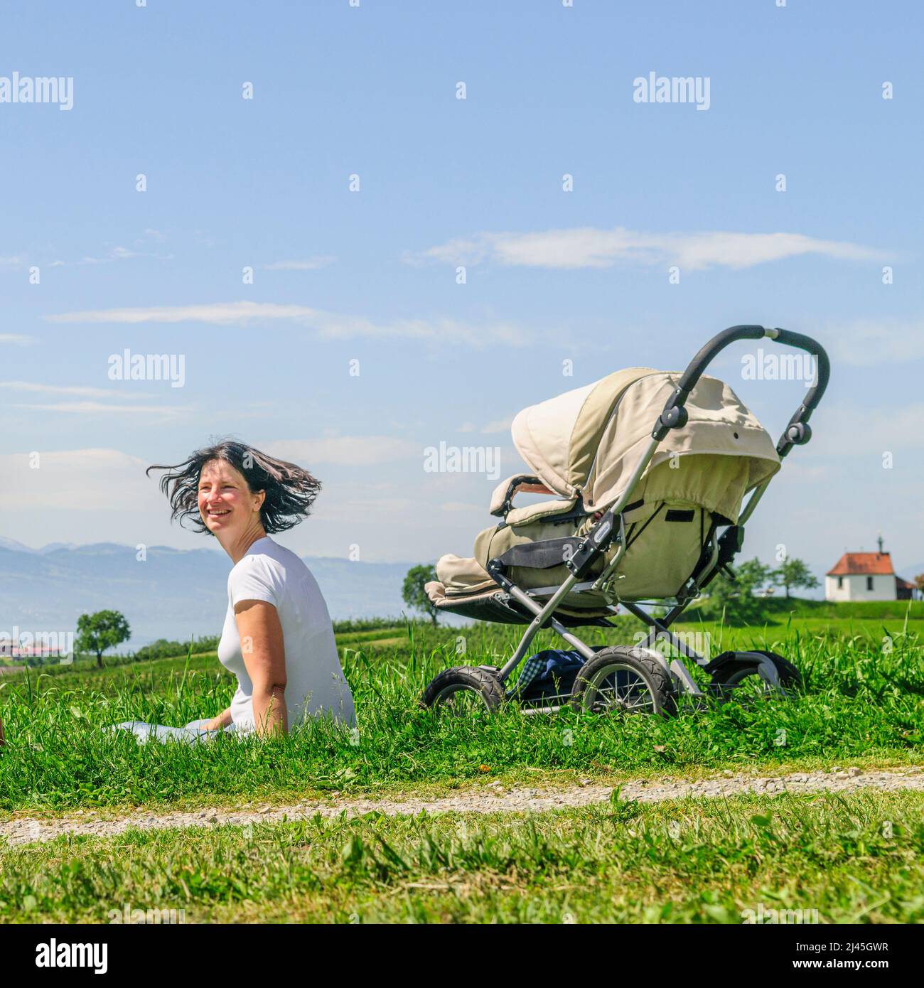 Enjoying springtime nature during a walk with offspring in pram Stock ...