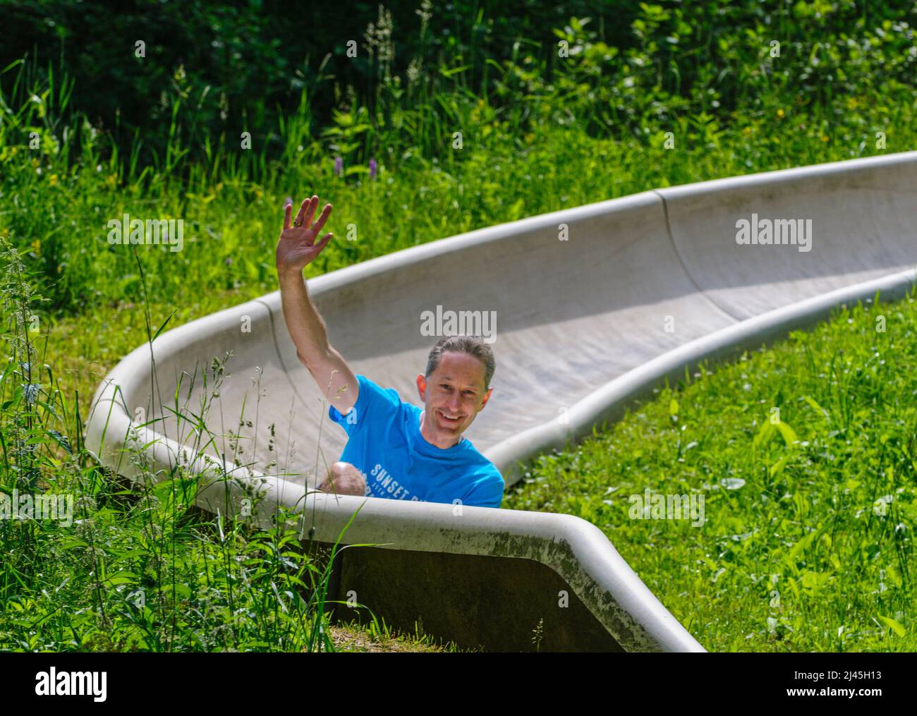 Family fun tobogganing in summer, up with the lift ... down with the ...