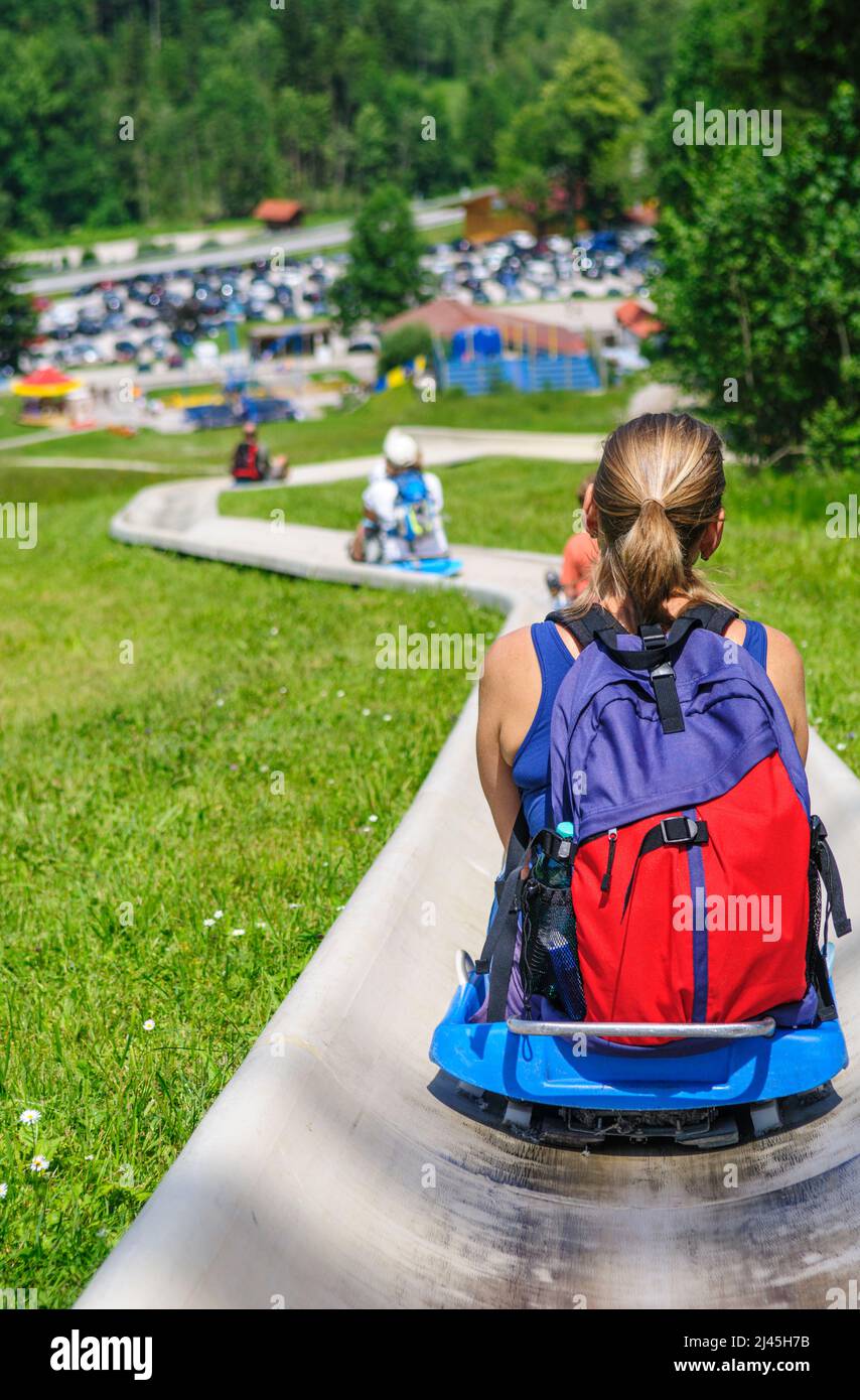 Family fun tobogganing in summer, up with the lift ... down with the ...