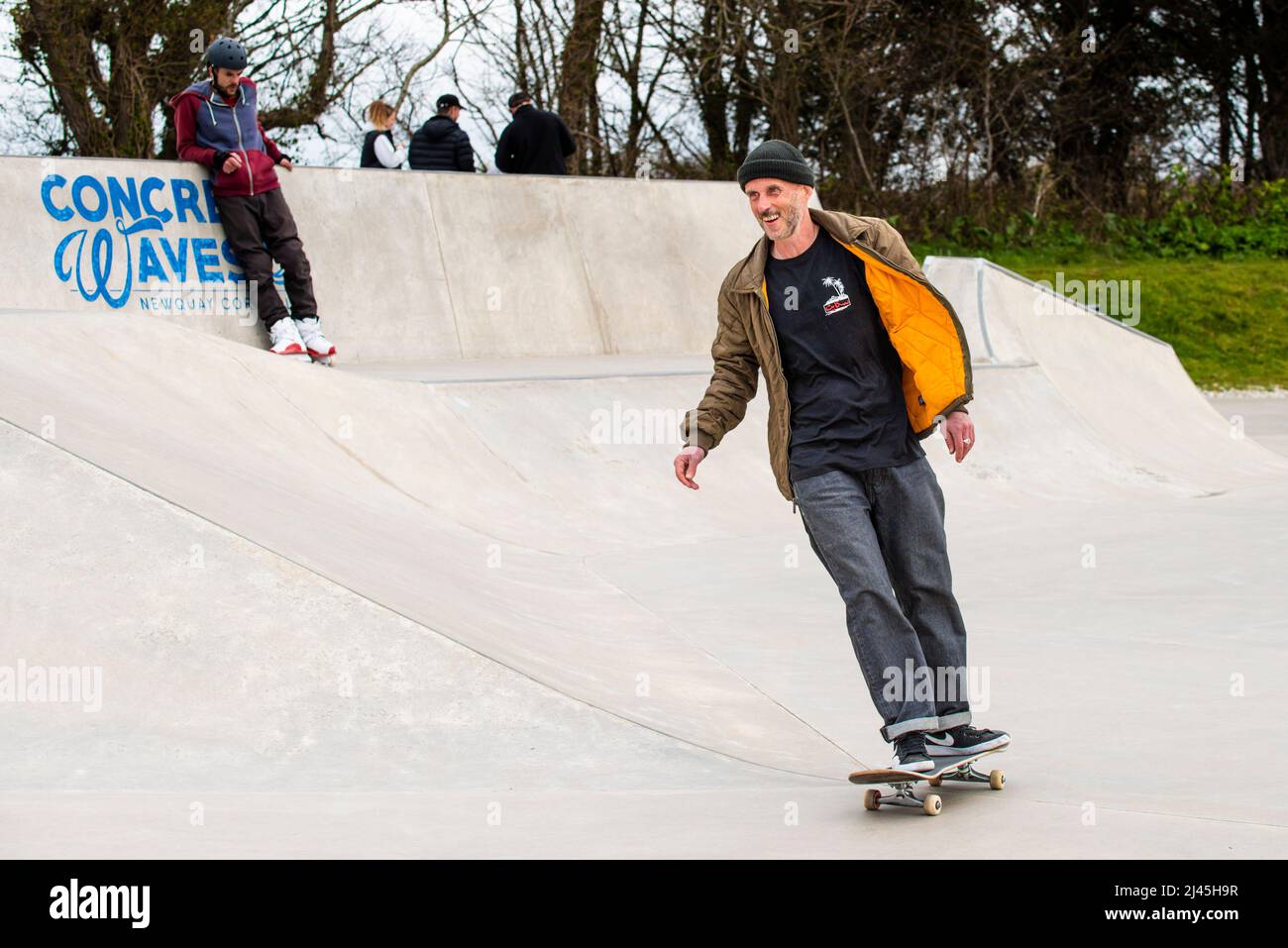 A mature male skateboarder enjoying himself at Newquay Concrete Waves ...