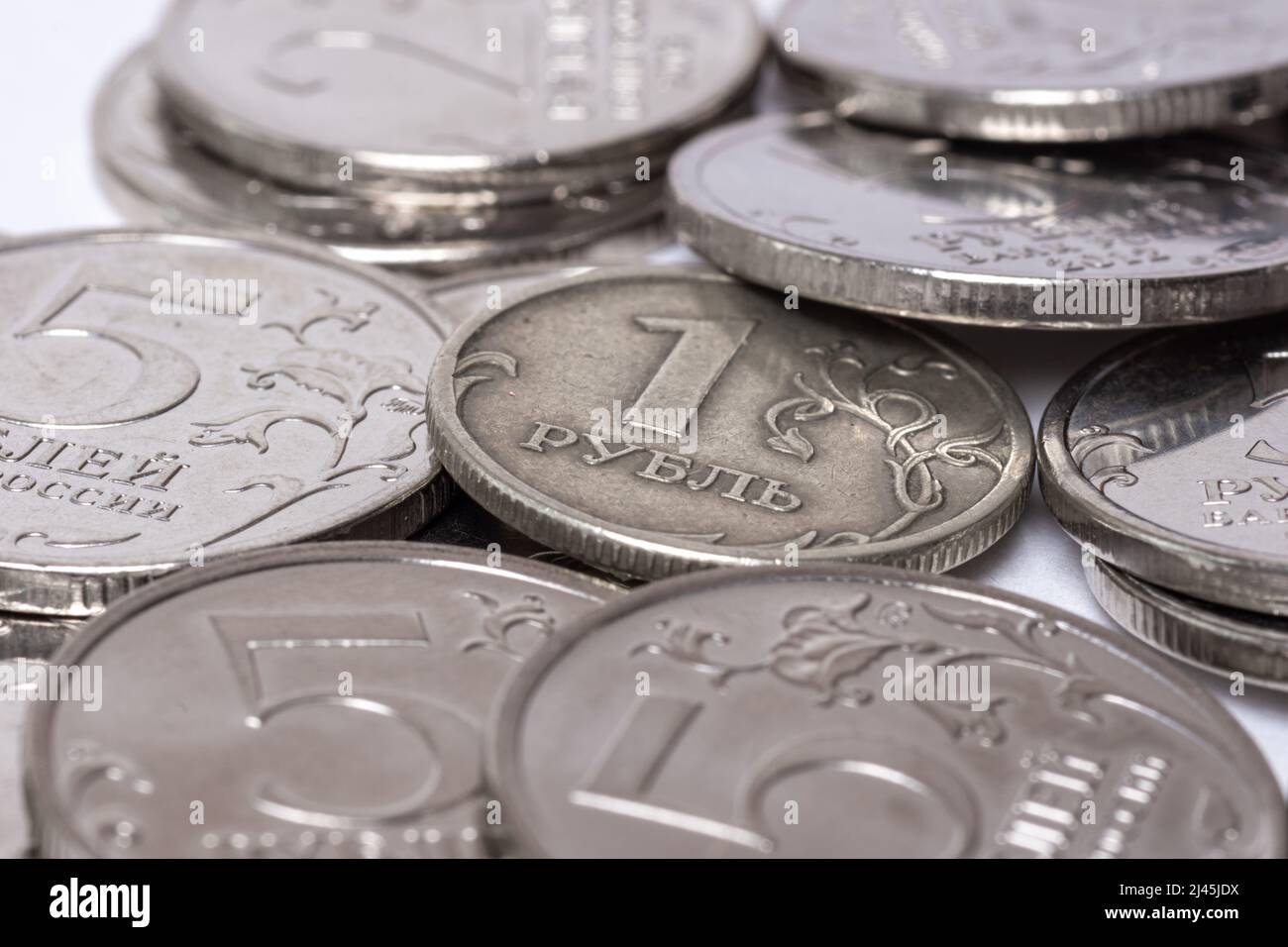 Background of coins of Russian rubles in denominations of 1 ruble, 2 ...