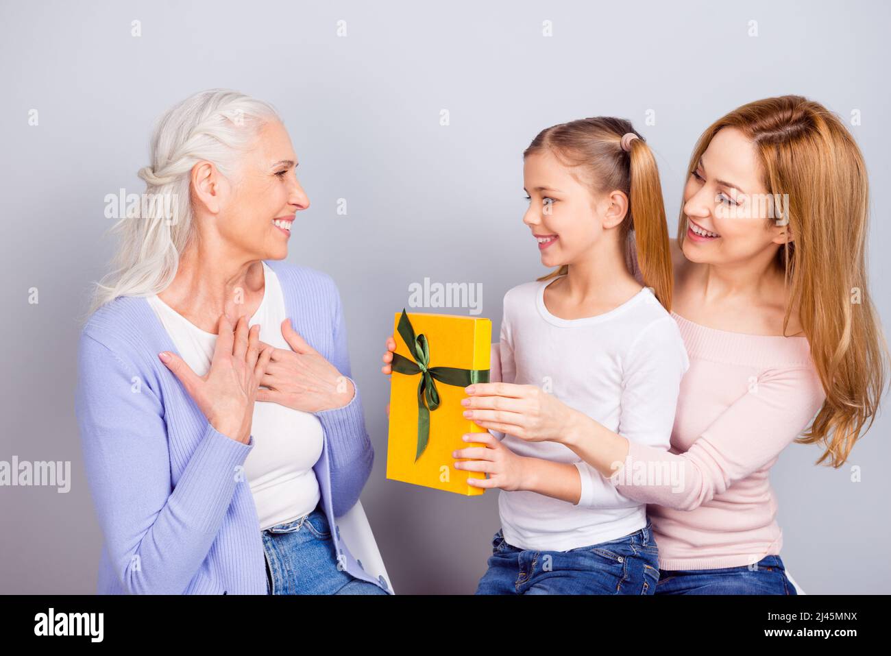 Photo of three idyllic peaceful people giving receive gift box isolated ...