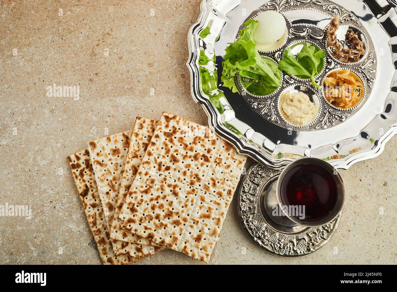 Passover Seder plate with traditional food ontravertine stone ...