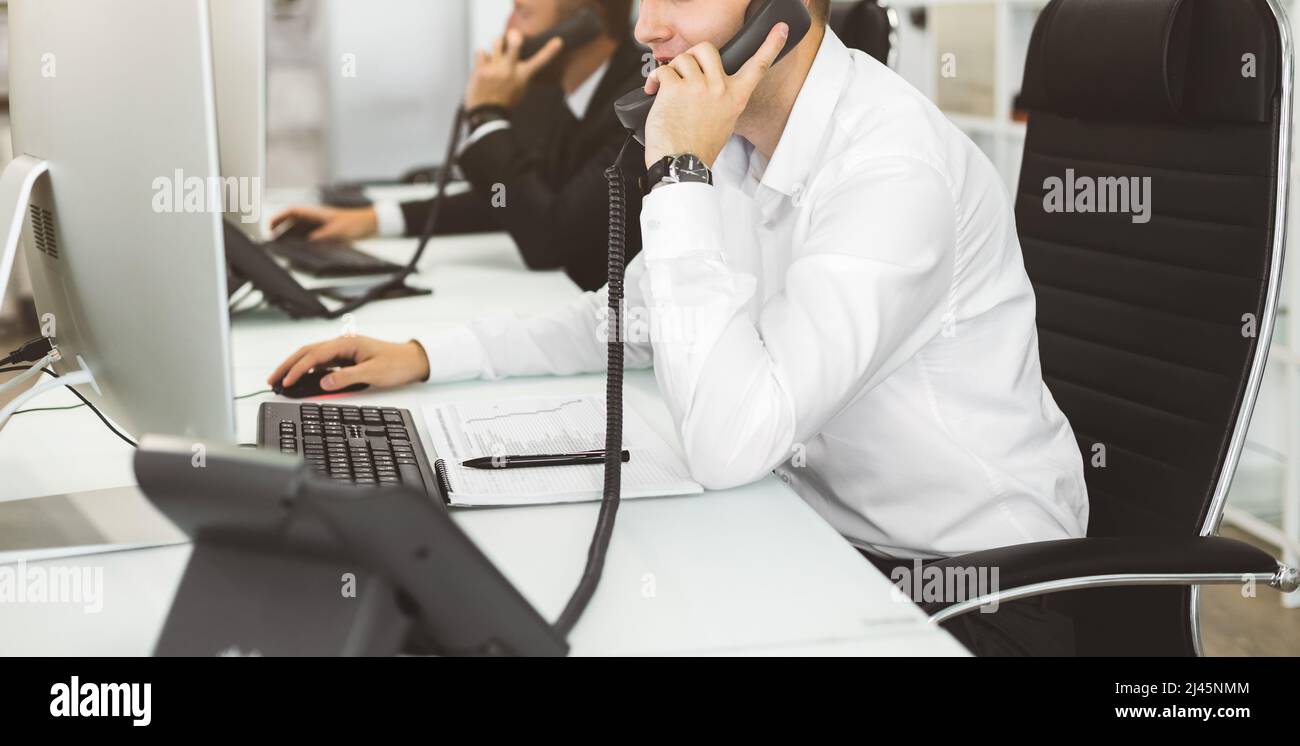 Employees of the company at work in the office. Workplace and everyday ...