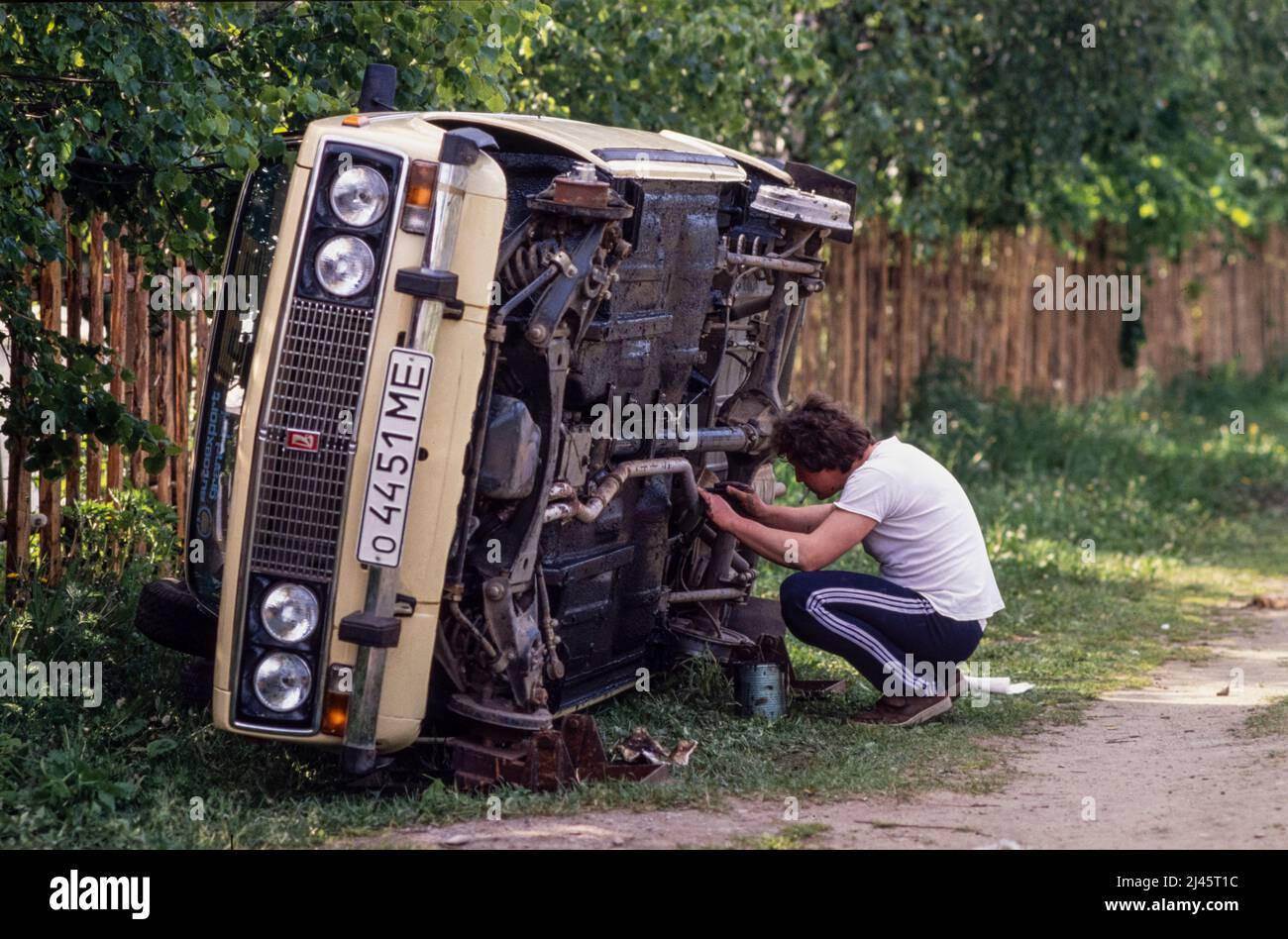 A man working on his Lada car, in town of Sergiyev Posad, 70 km from ...