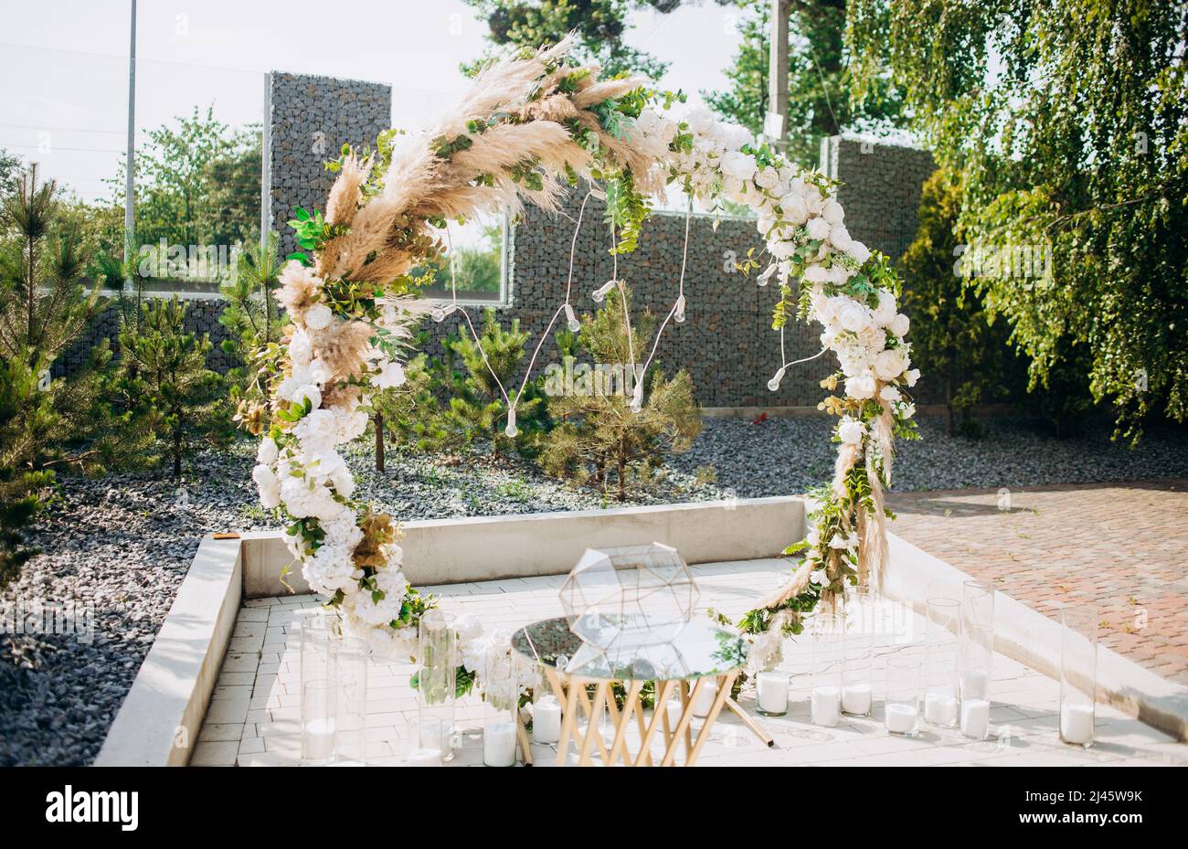 The round arch is decorated with flowers and dried flowers. Details of ...