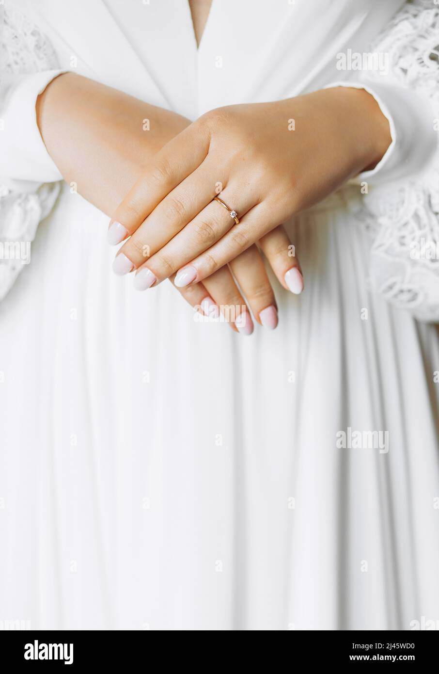 Gentle hands. Wedding details Stock Photo - Alamy