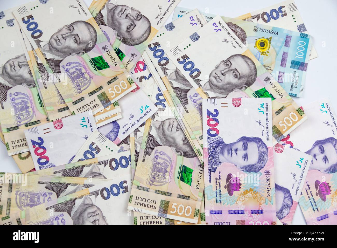 Ukrainian money currency of different denominations scattered. Hryvnia ...