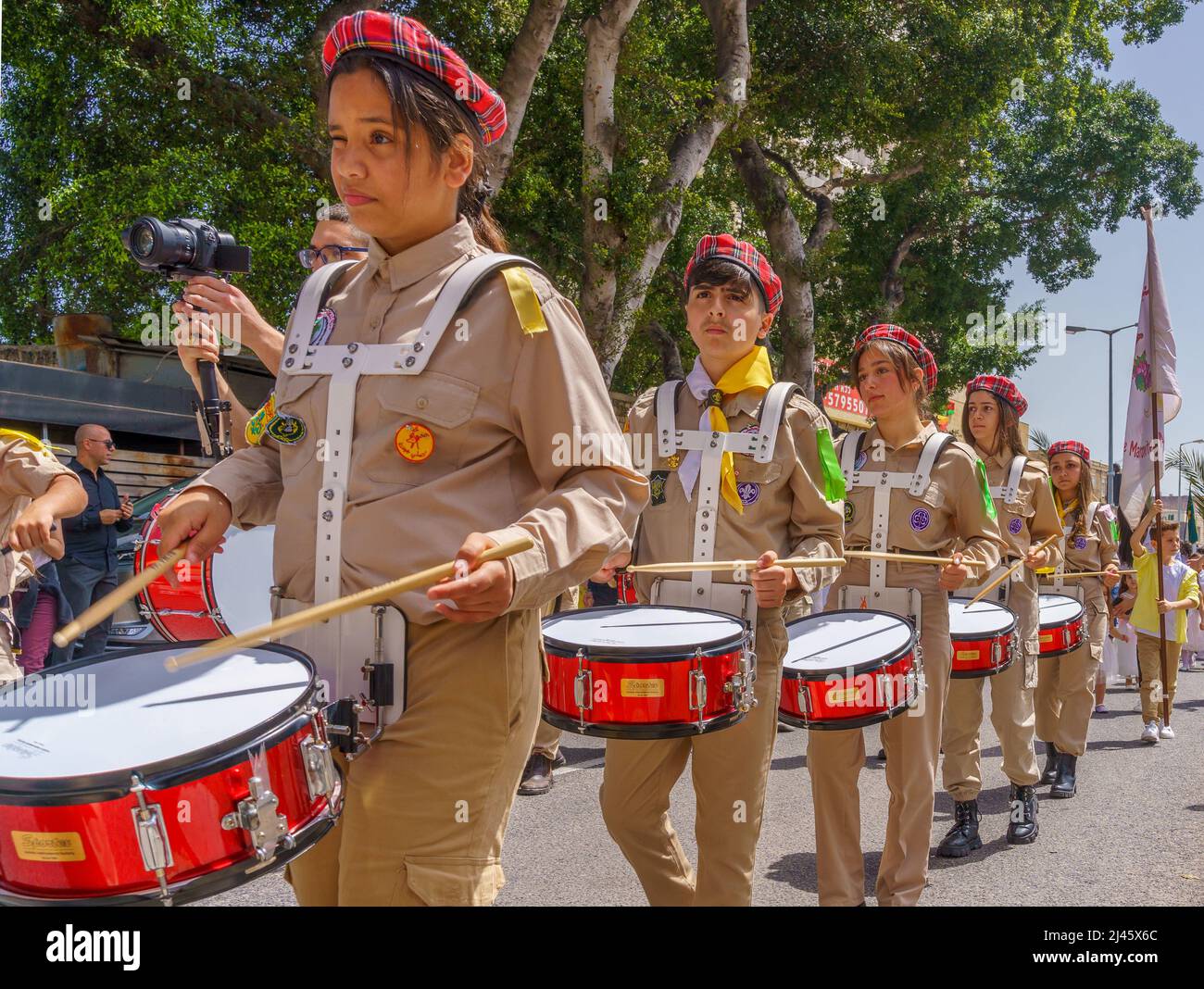 Haifa, Israel - April 10, 2022: Scout drummers and others take part in the Easter Palm Sunday ...