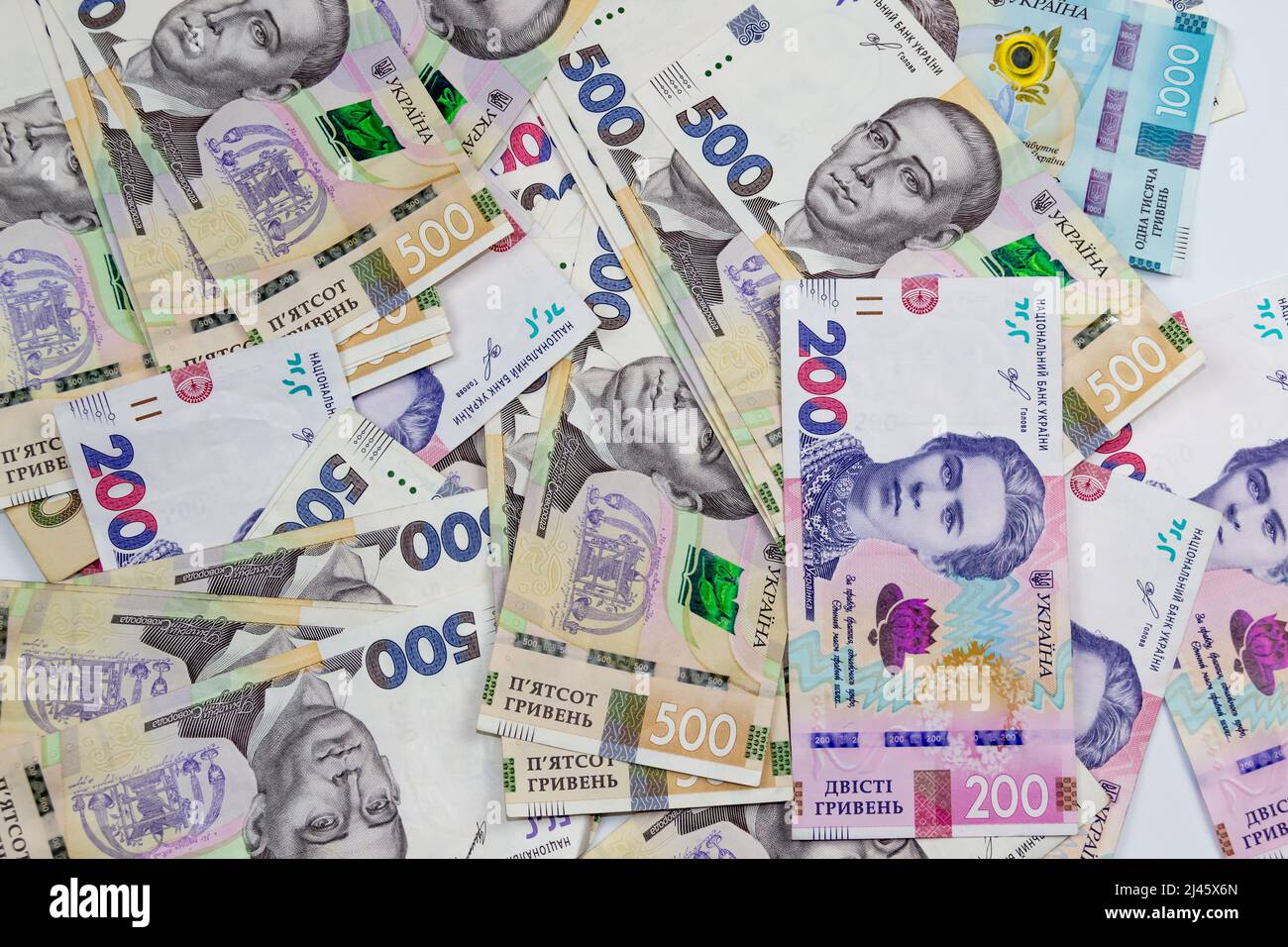 Ukrainian money currency of different denominations scattered. Hryvnia ...