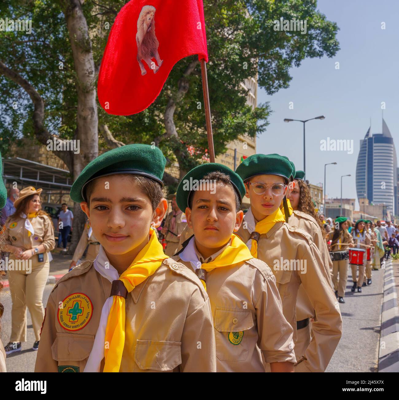 Haifa, Israel - April 10, 2022: Young scouts and others take part in the Easter Palm Sunday ...