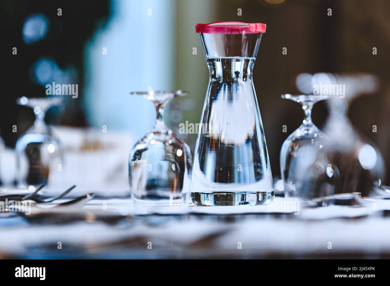 Water jug on a table in a restaurant Stock Photo - Alamy