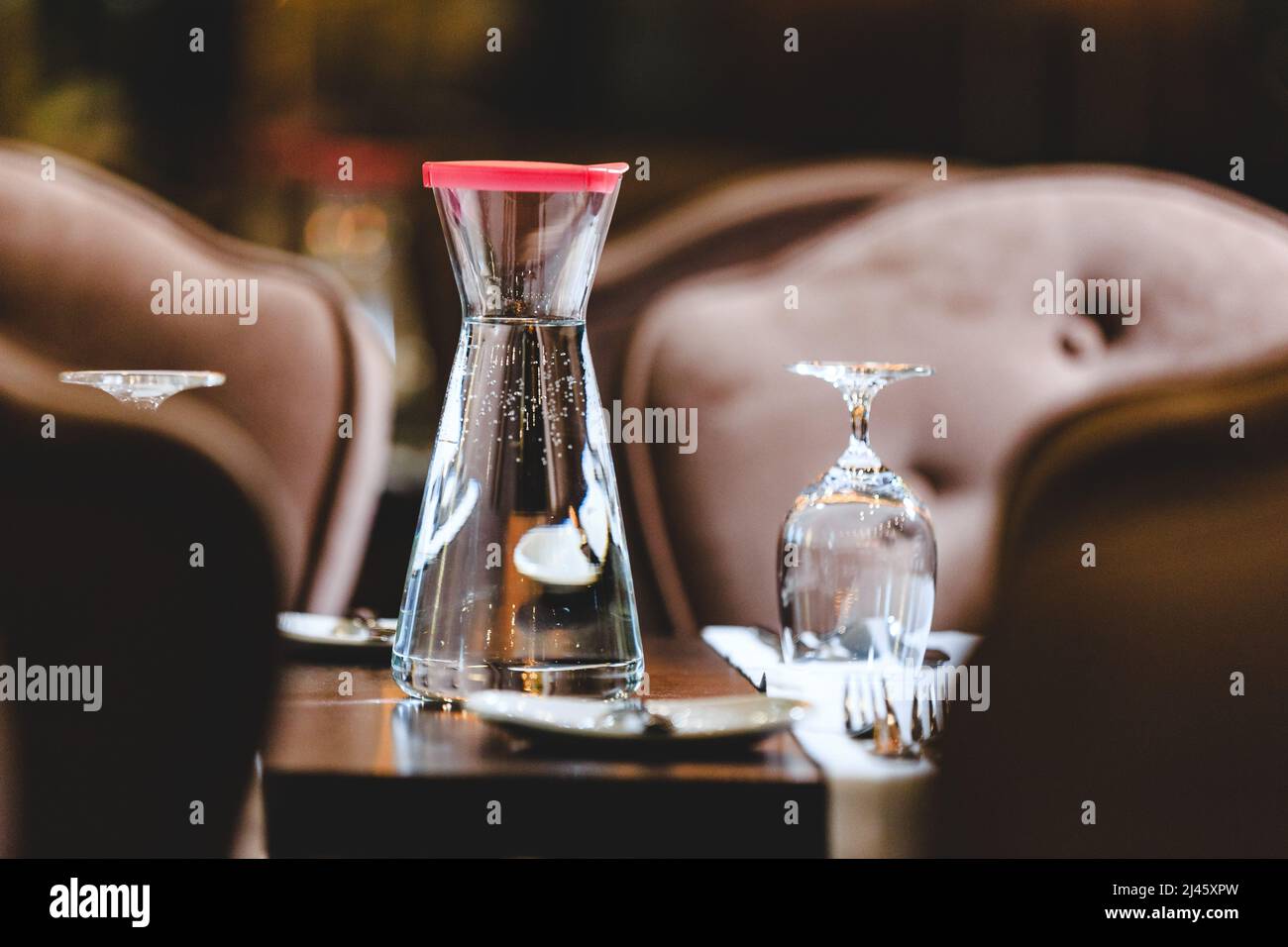 Water jug on a table in a restaurant Stock Photo - Alamy