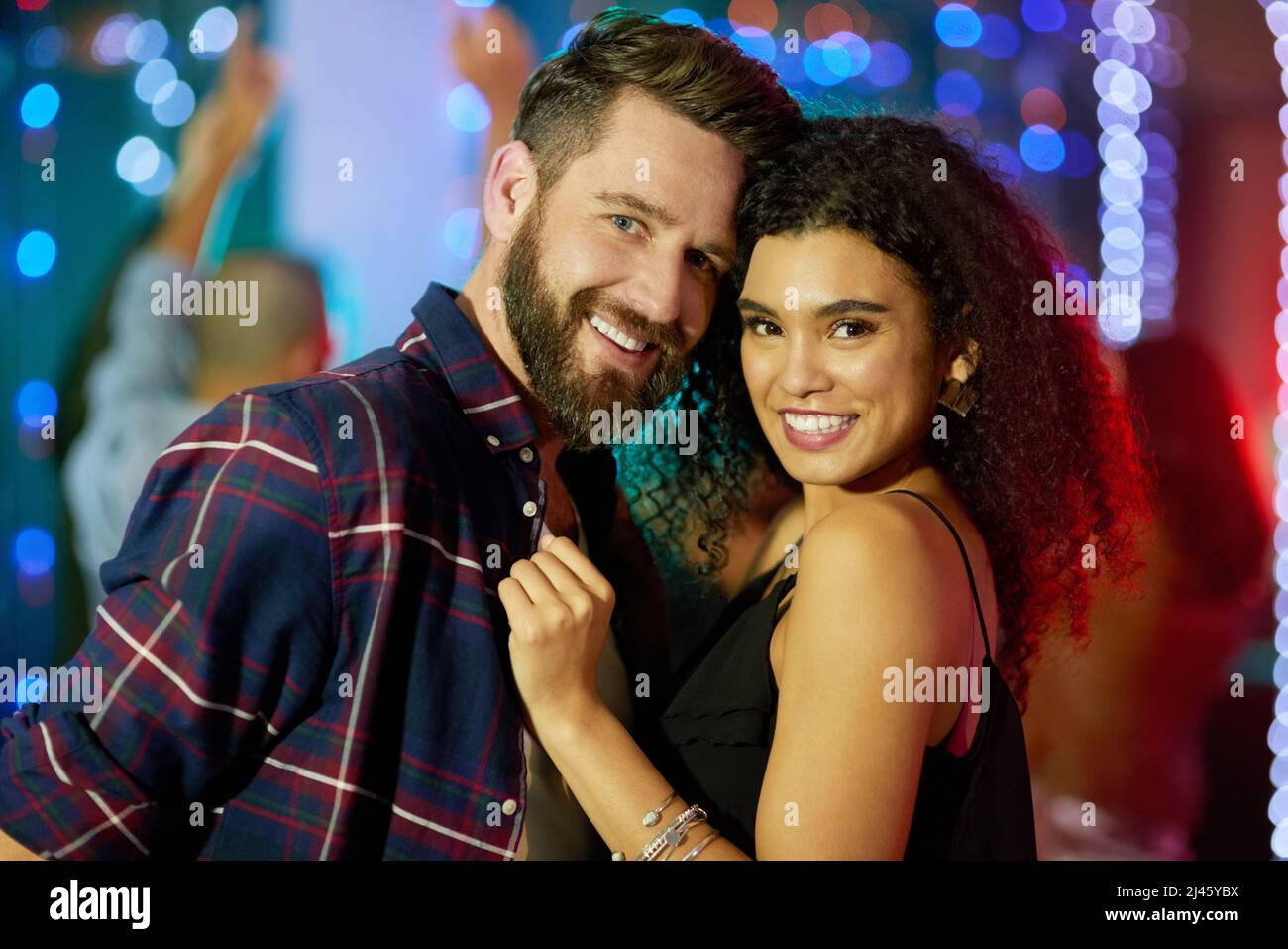 Enjoying a couples night out at the club. Portrait of an affectionate ...
