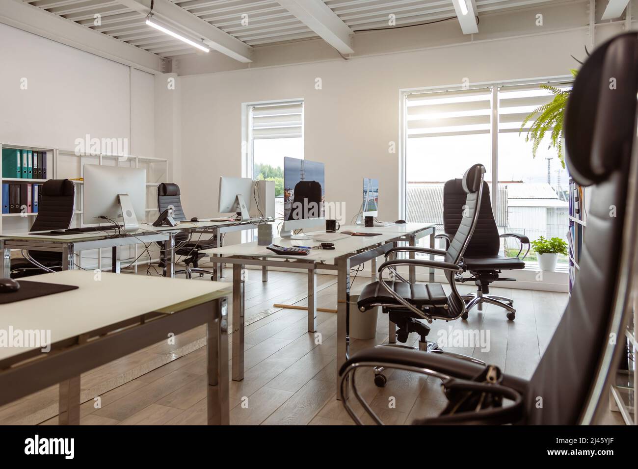 Interior of a modern light small company office. Workspace, office ...