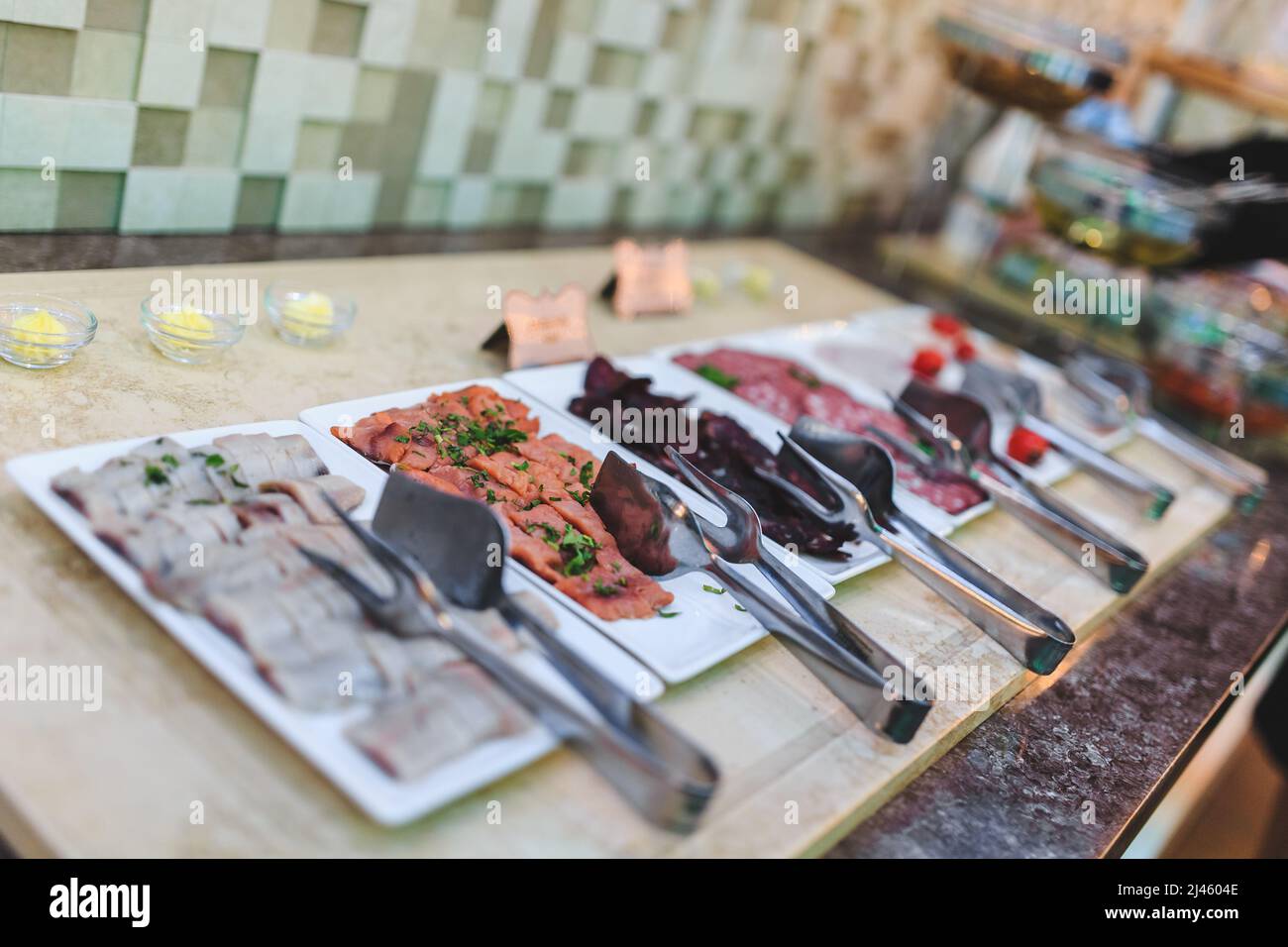 Beautifully designed buffet table in the hotel restaurant with sliced ...