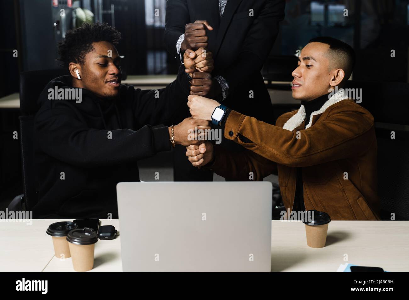 Teambuilding. Making hand stack of fists. Community spirit and ...