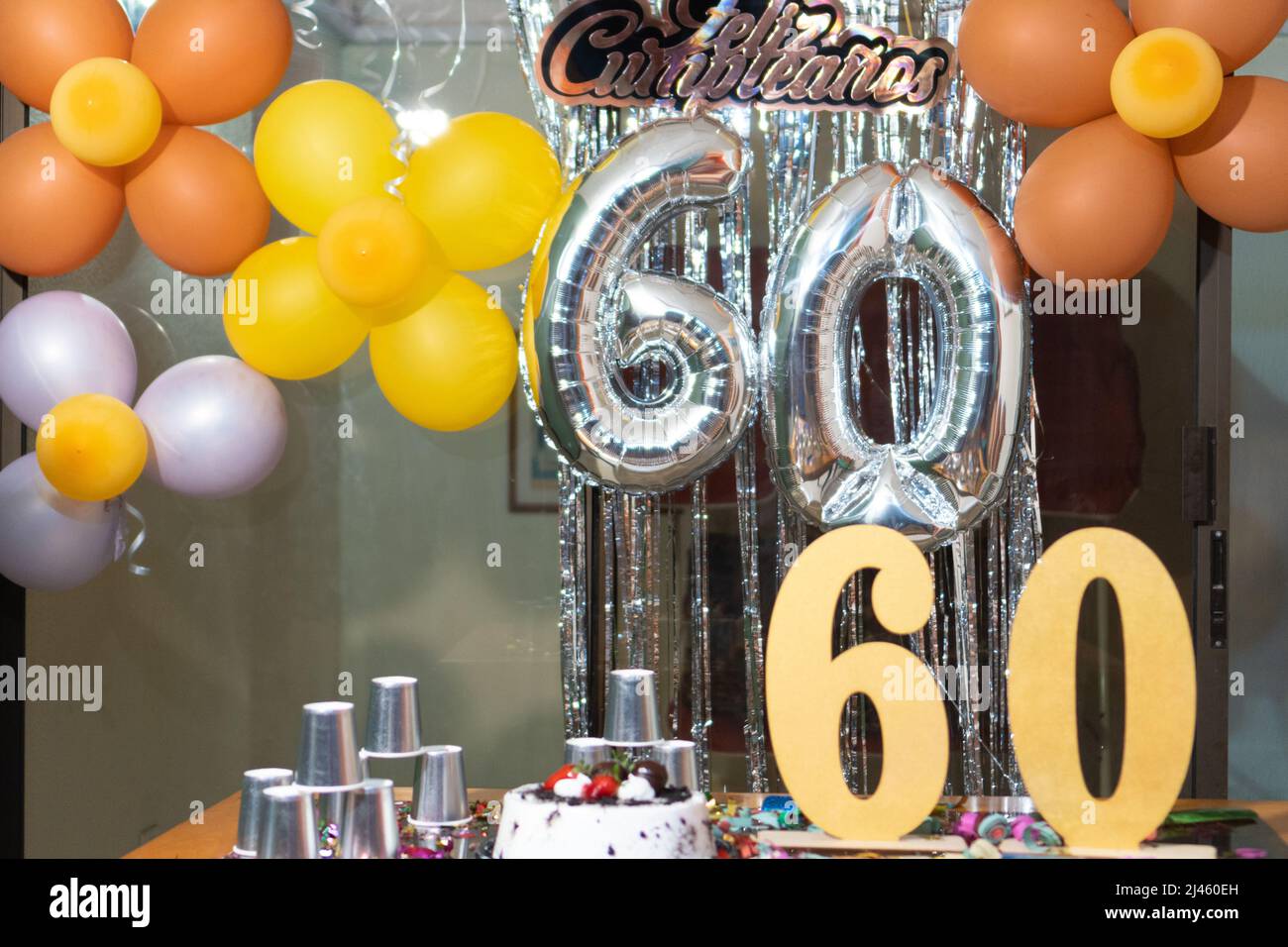 Decoration with number 60 balloons at birthday party Stock Photo - Alamy