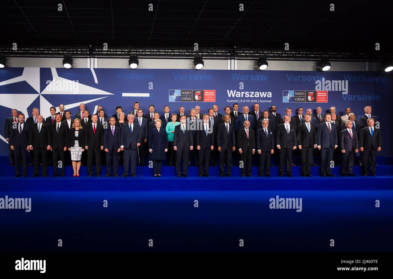 Participants of the NATO summit pose for a group photo in Warsaw Stock ...